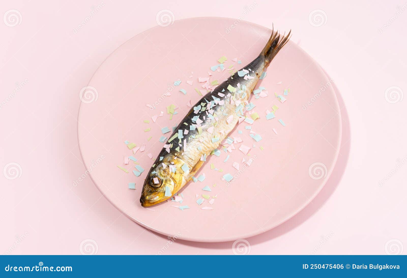 Fish Covered Microplastic on a Pink Plate. Impact of Micro Plastic on ...