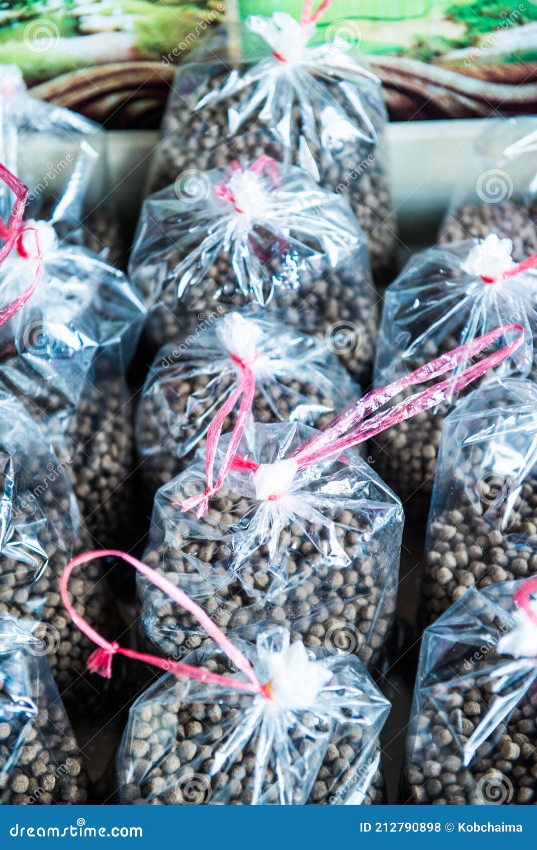 Fish feed in plastic bag stock photo. Image of package - 212790898