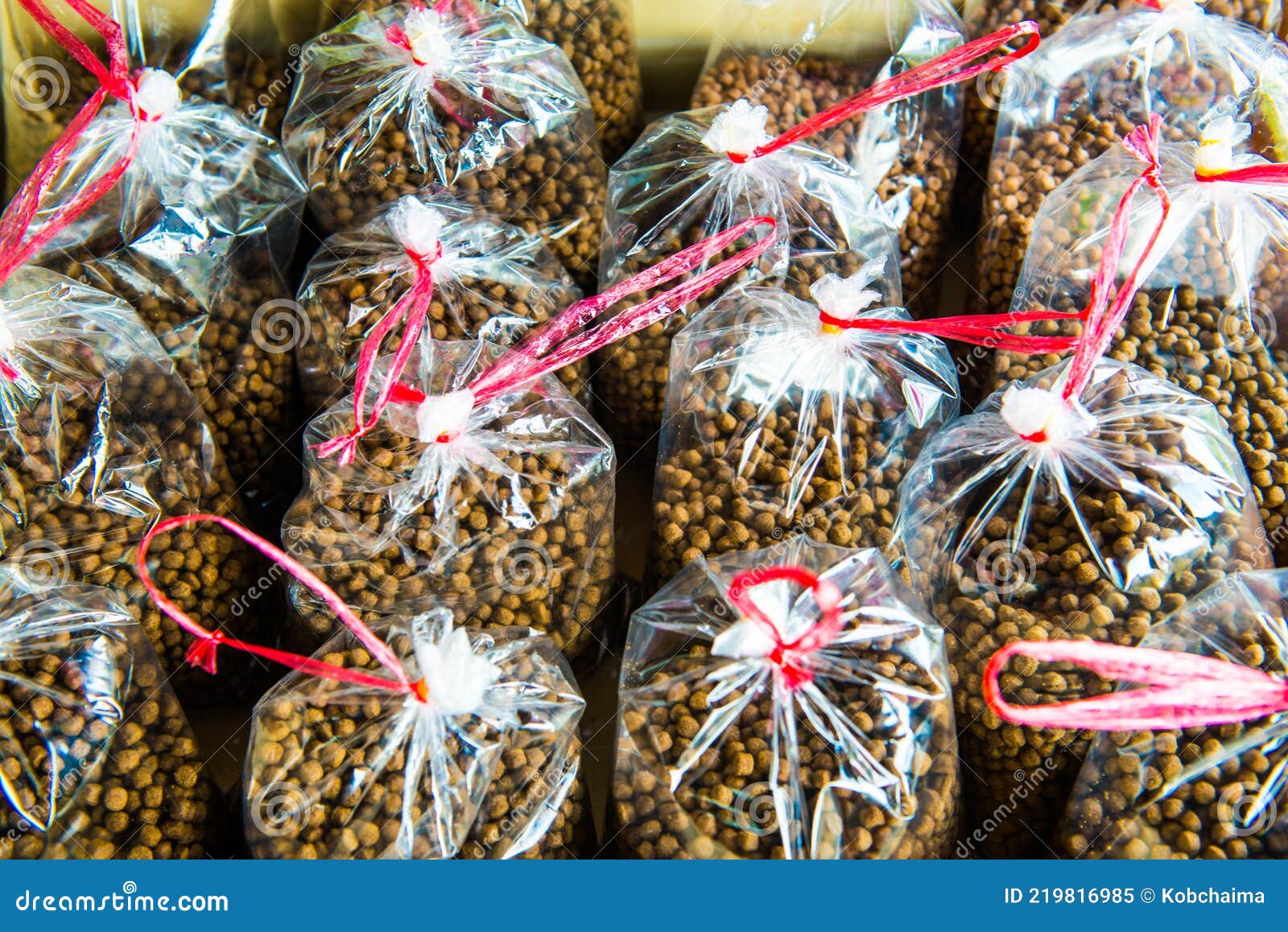 Fish feed in plastic bag stock image. Image of detail - 219816985