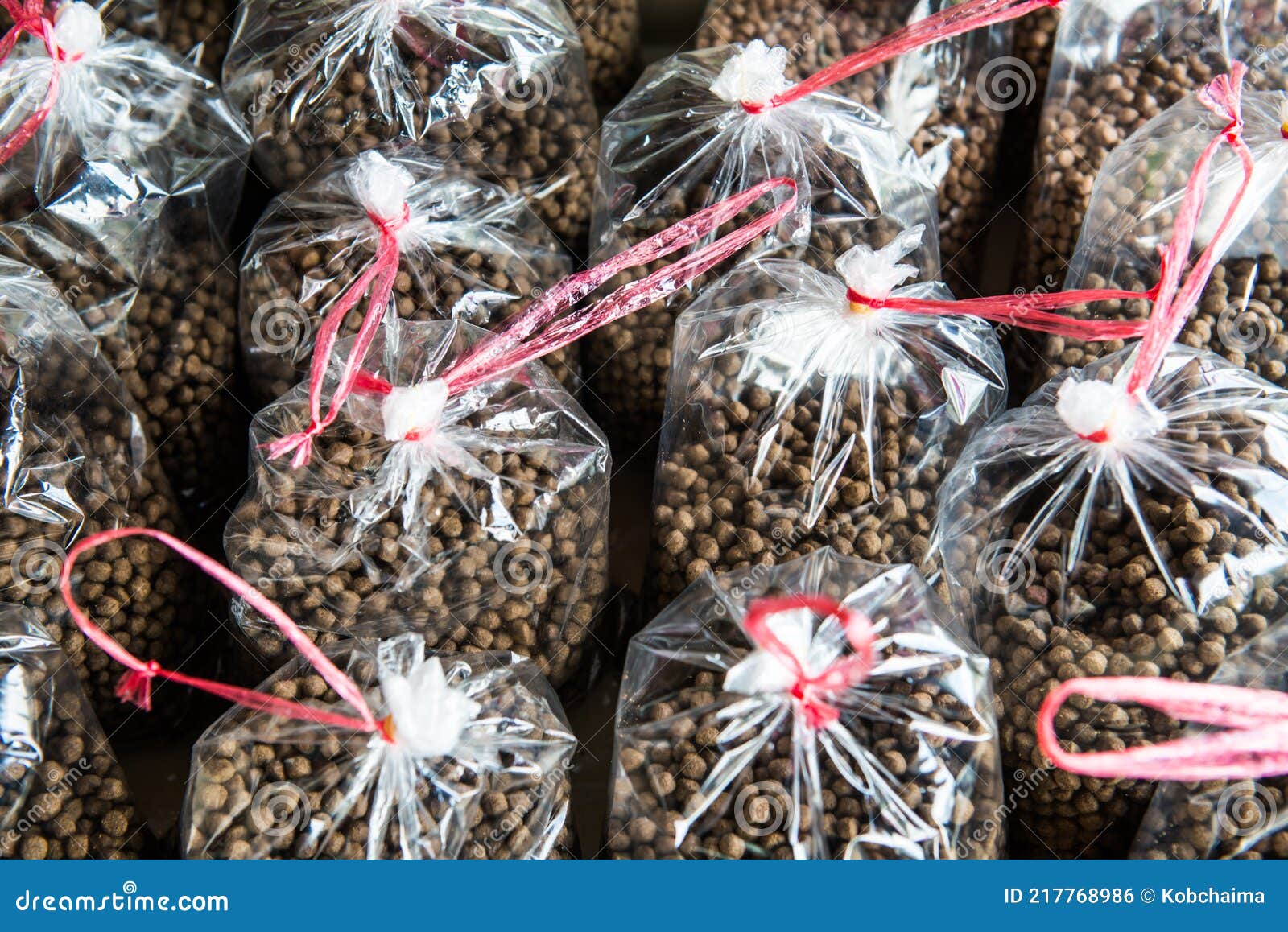 Fish feed in plastic bag stock photo. Image of small - 217768986