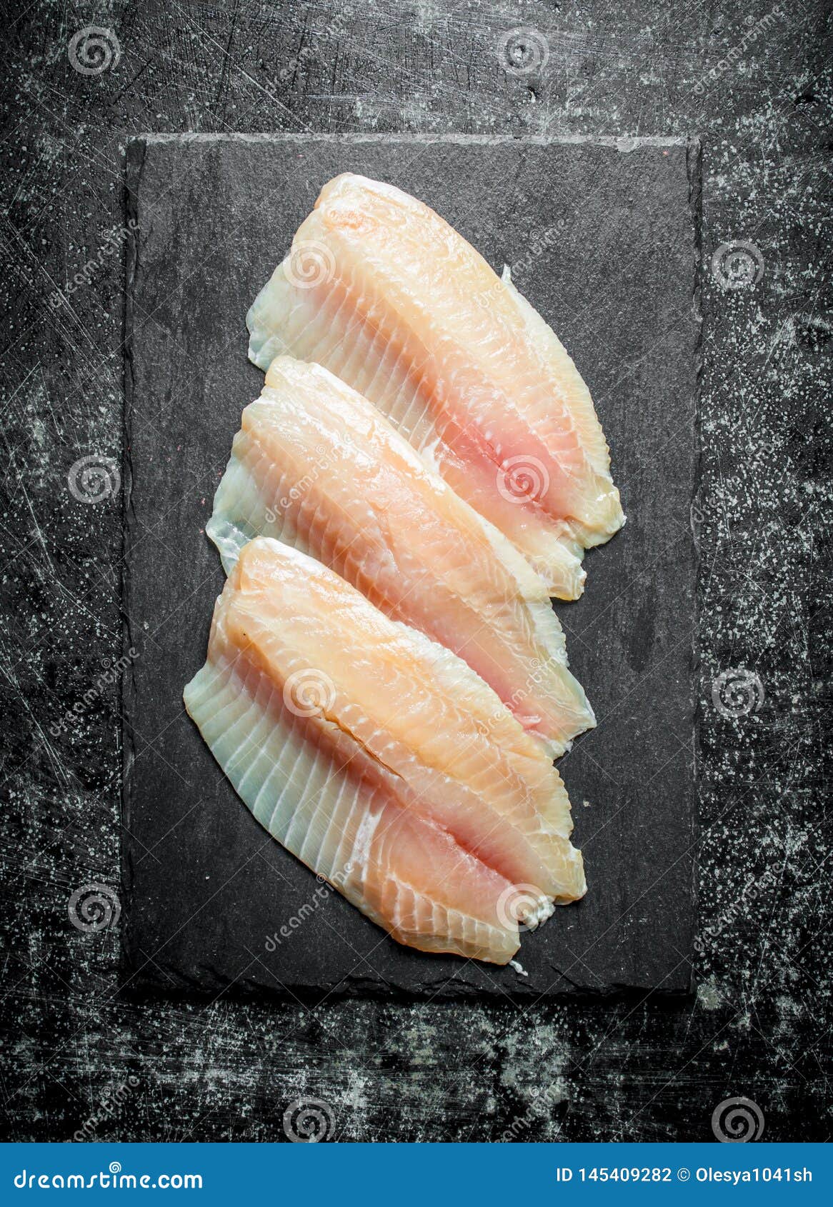 Fish Fillet on a Black Stone Board Stock Photo - Image of fillet ...