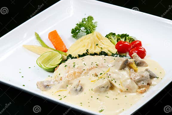Fish fillet in white sauce stock image. Image of sauce - 19964719