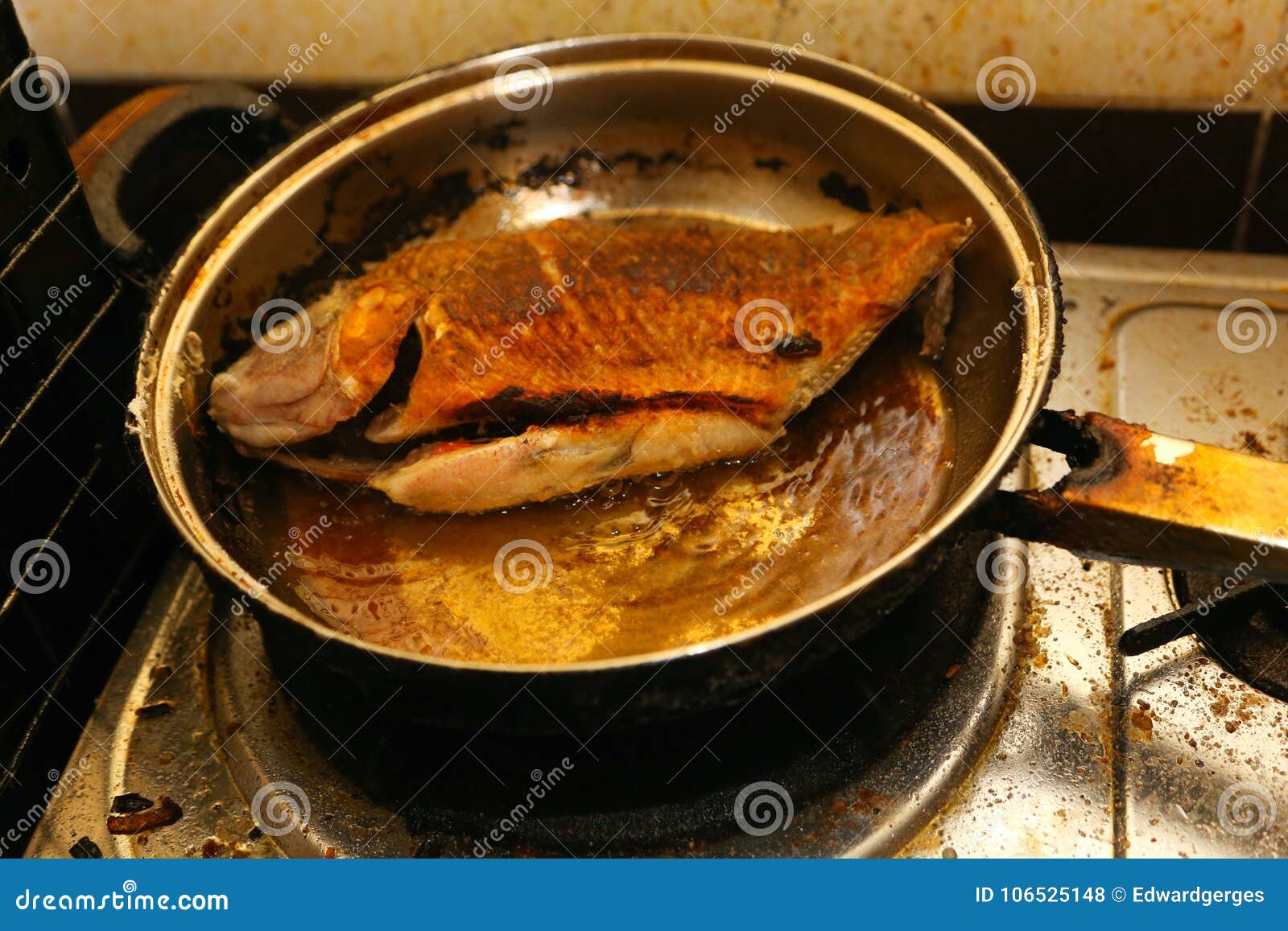 Fish fried in a frying pan stock photo. Image of frying - 106525148
