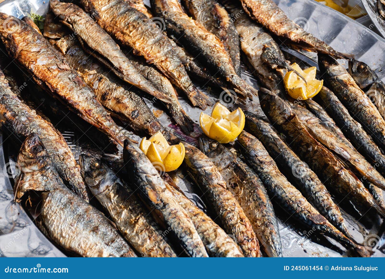 Fish Fried on a Plate with Lemon. Stock Photo - Image of golden, clupea ...