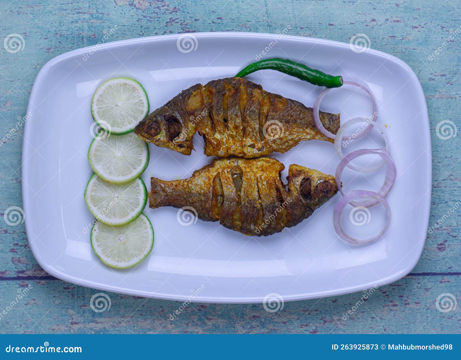 Fish Fry with Onion Slice, Lemon Slice and Chilli Stock Image - Image ...