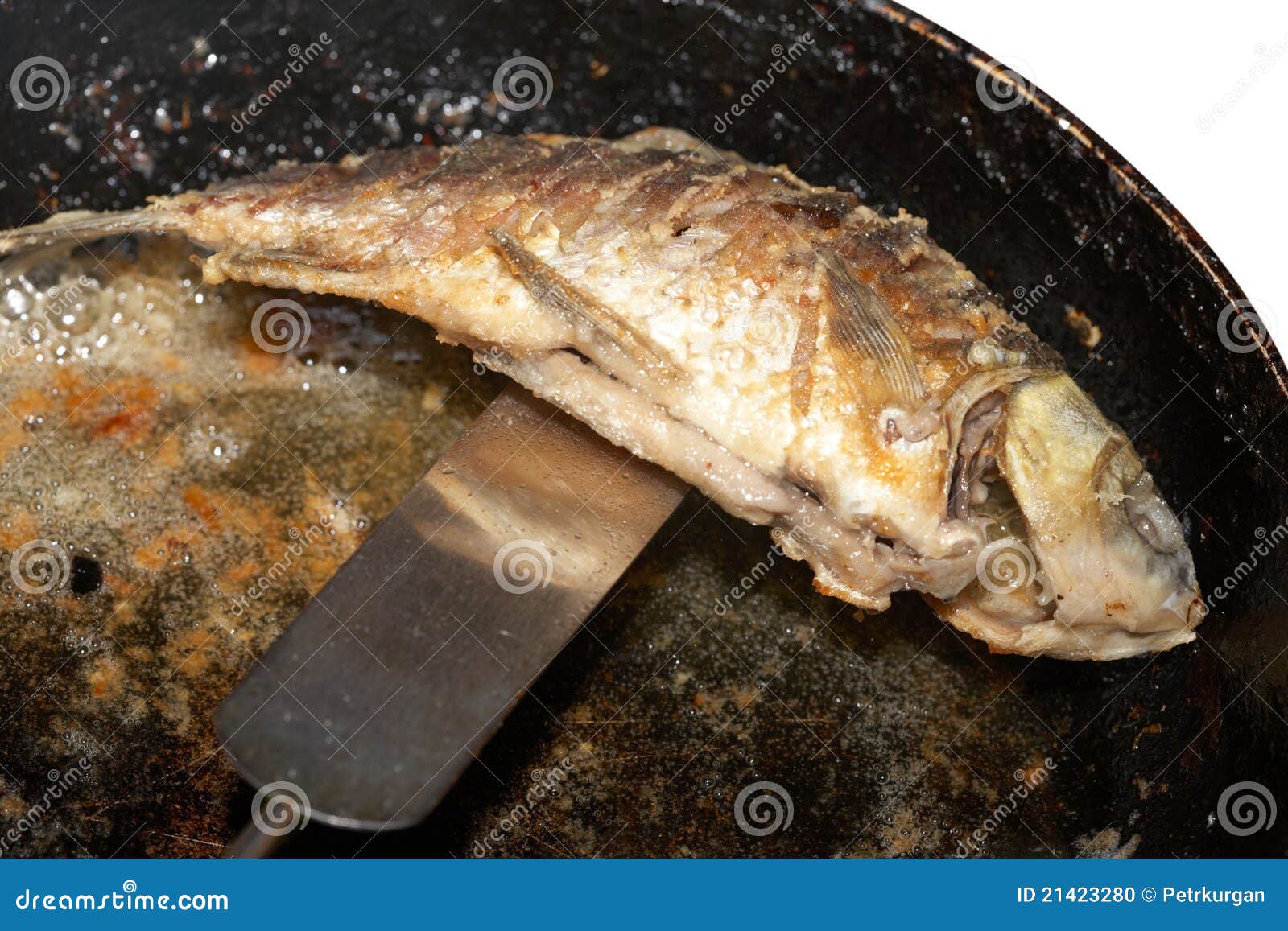 Fish on a frying pan stock photo. Image of isolated, crucian - 21423280