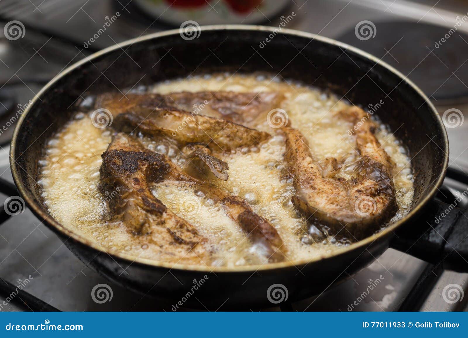 Fish frying in a pan stock image. Image of gourmet, dish - 77011933