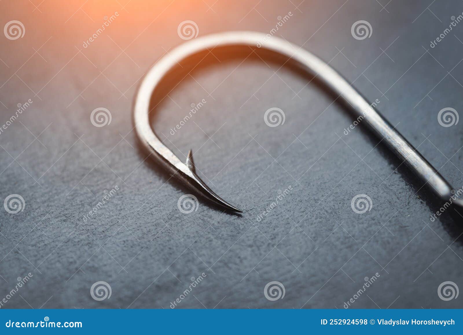 Fish Hook on a Black Background with Bright Orange Backlight Stock ...