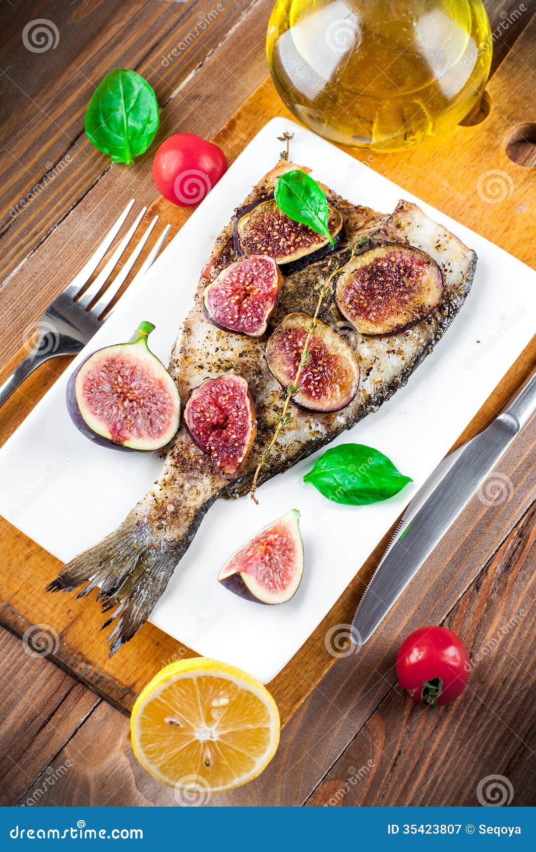 Fish with lemon and figs stock image. Image of grilled - 35423807