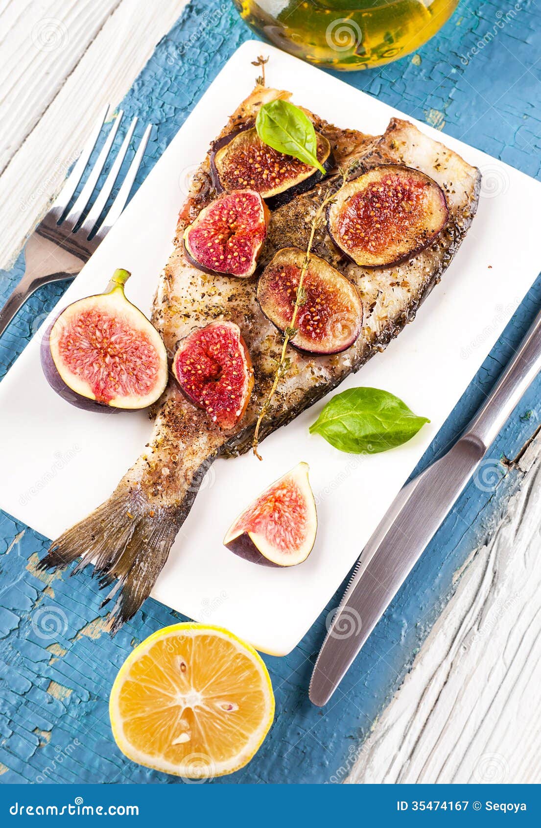 Fish with lemon and figs stock image. Image of mackerel - 35474167