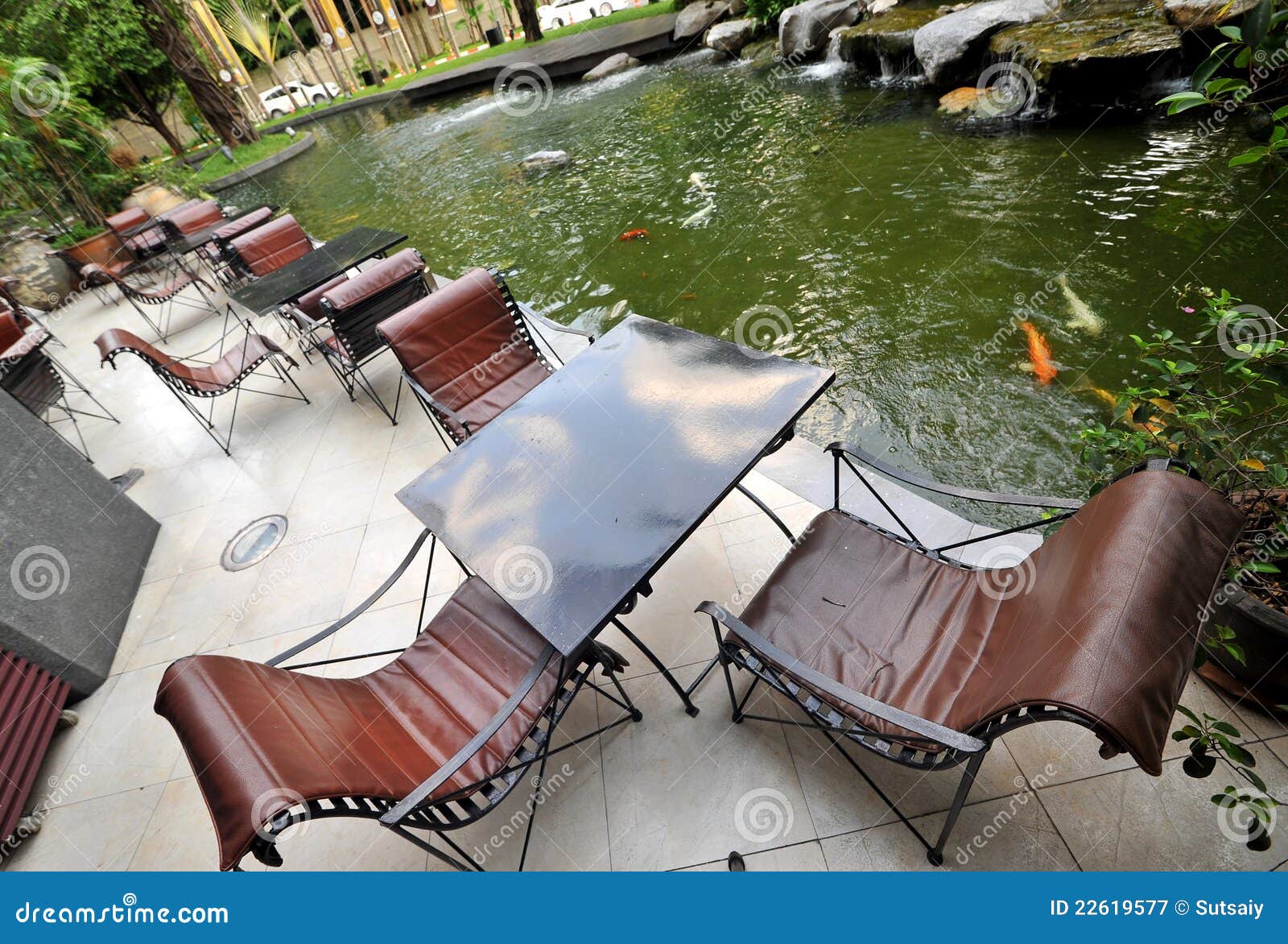 Fish pond and chair stock image. Image of foliage, lilly - 22619577
