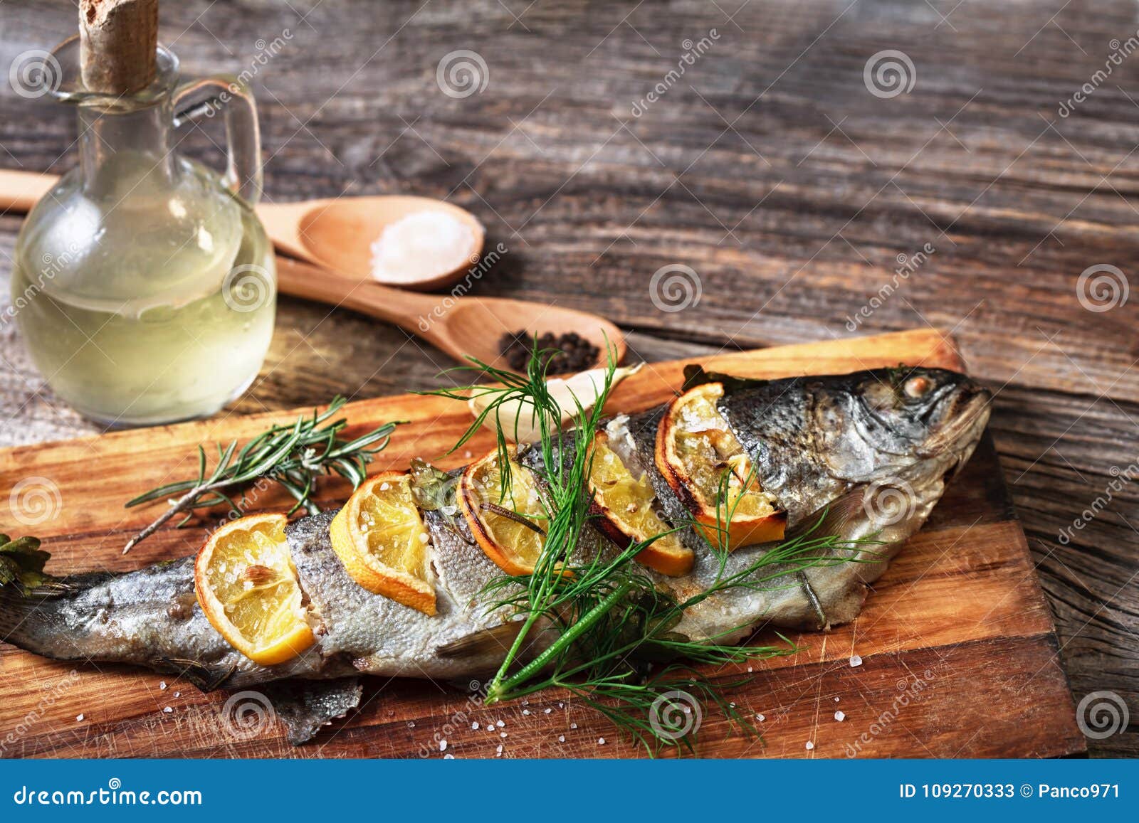 Fish on Rustic Table with Fresh Ingredients for Cooking Stock Image ...
