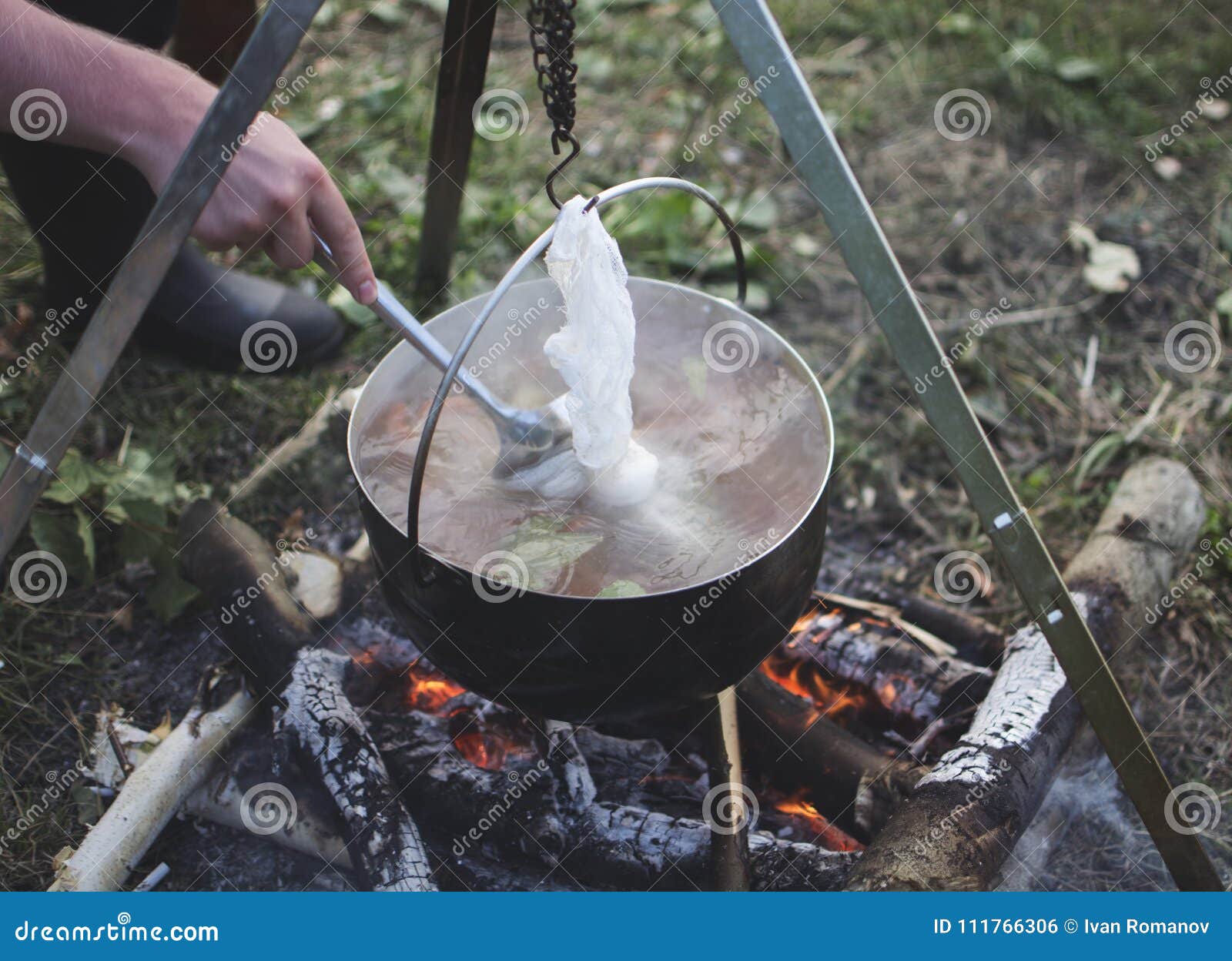 Cauldron on fire in forest stock photo. Image of dinner - 111766306
