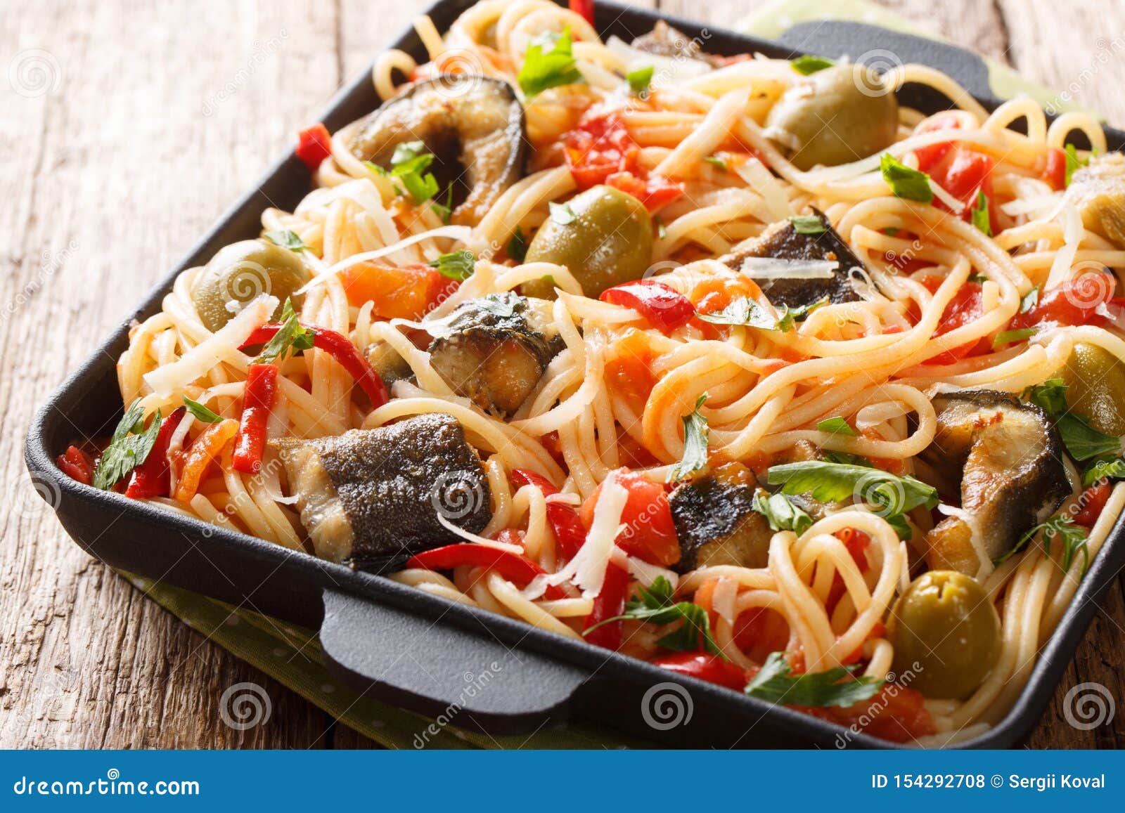 Fish Spaghetti with Fried Eel, Olives, Pepper and Tomato Sauce Close-up ...