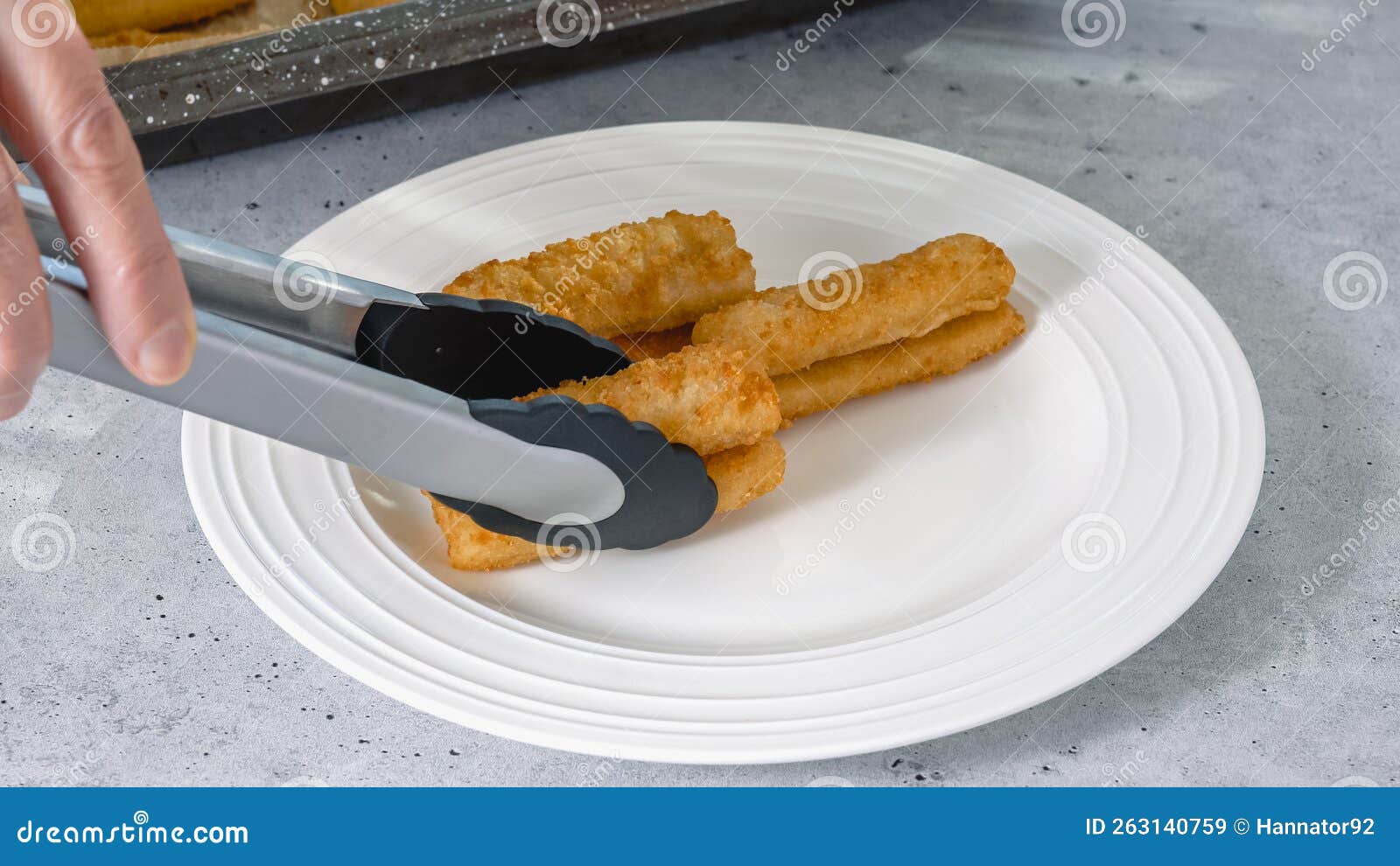 Fish Sticks in a Crunchy Golden Breading Close-up on White Plate Stock ...