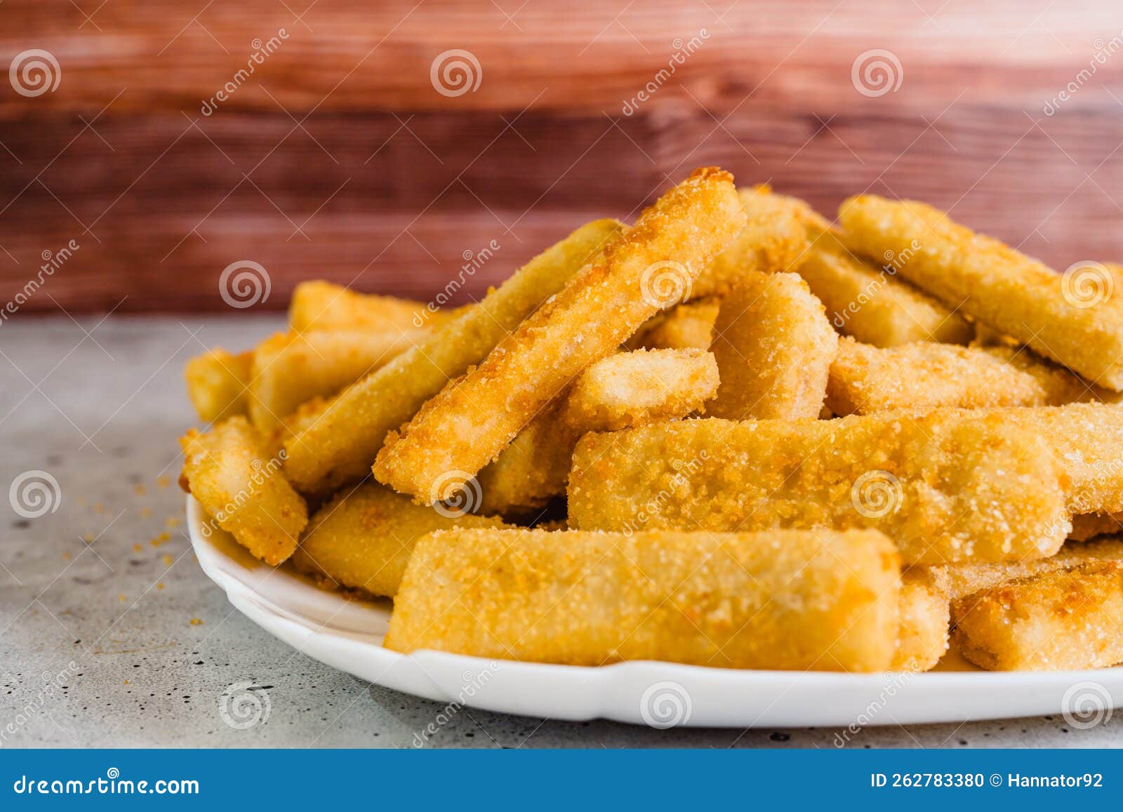 Fish Sticks in a Crunchy Golden Breading Close-up on White Plate on the ...