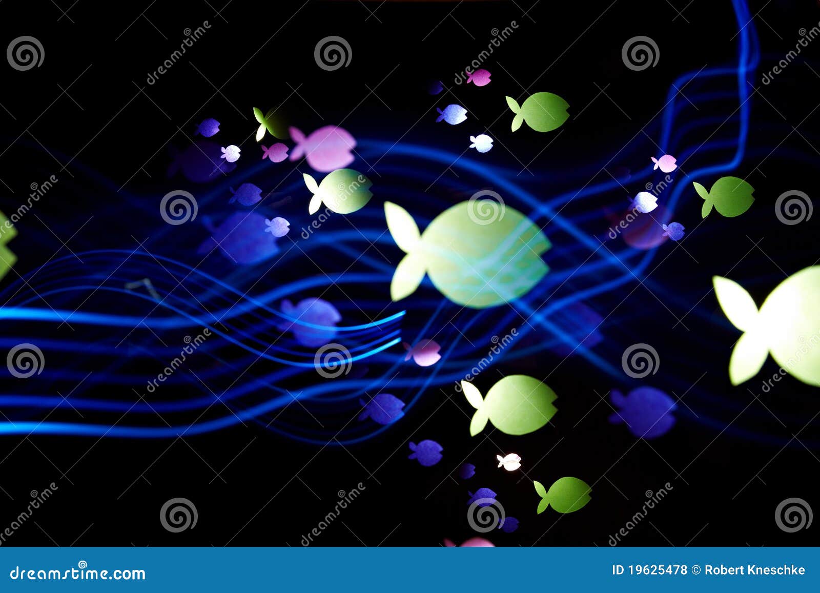 Fish swarm in light waves stock photo. Image of dark - 19625478