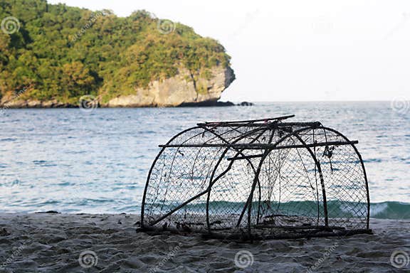 Fish trap on the beach stock photo. Image of crab, equipment - 77890020