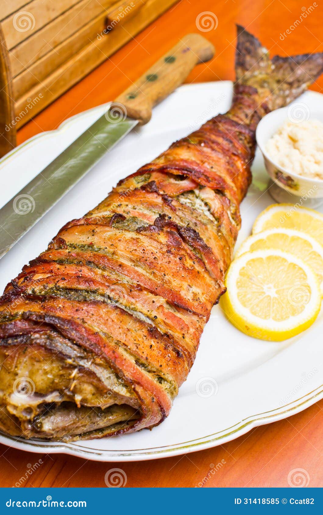 Fish wrapped in bacon stock image. Image of pork, trout - 31418585