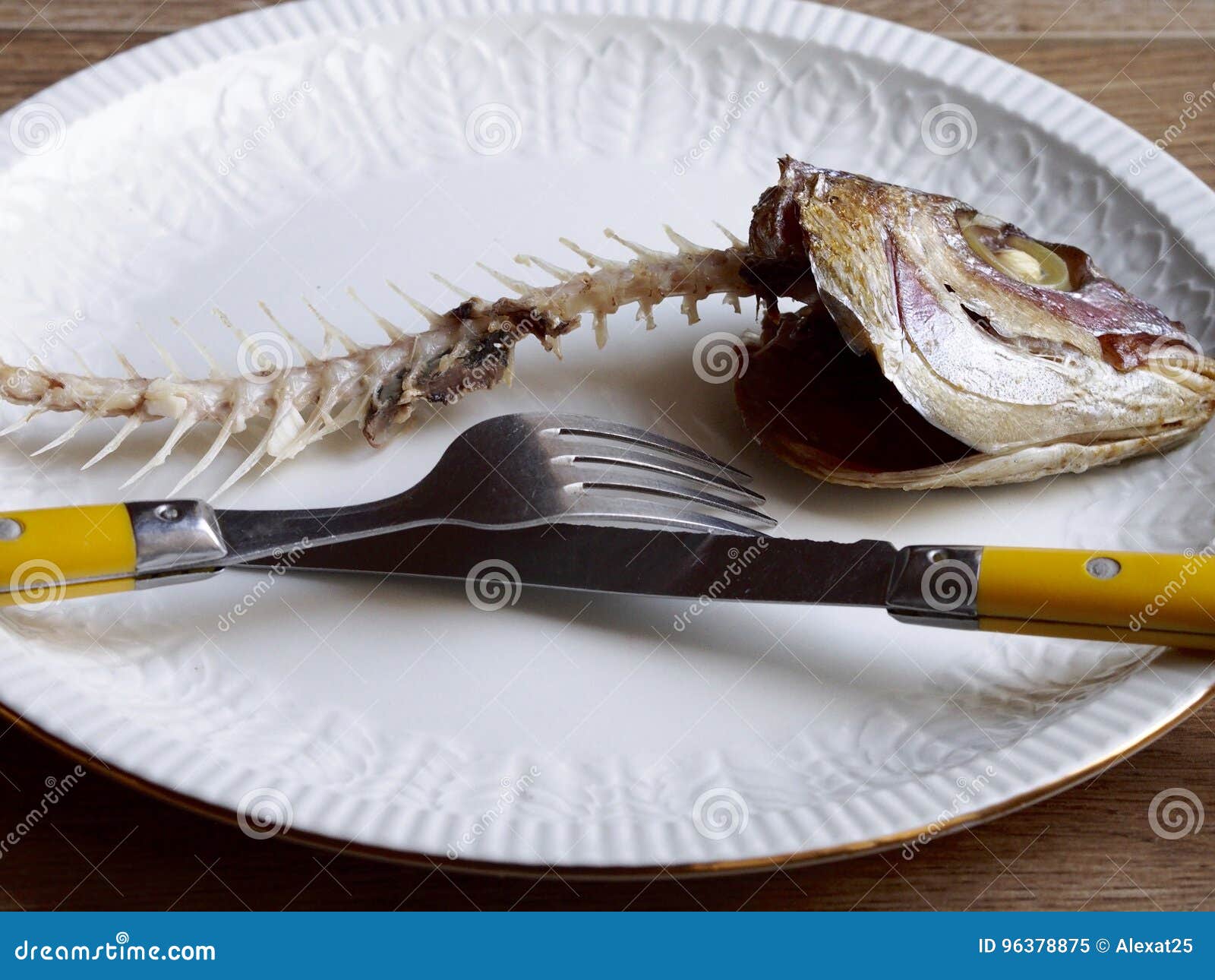 Fishbone With Fork And Knife In A Beautiful Plate Royalty-Free Stock ...