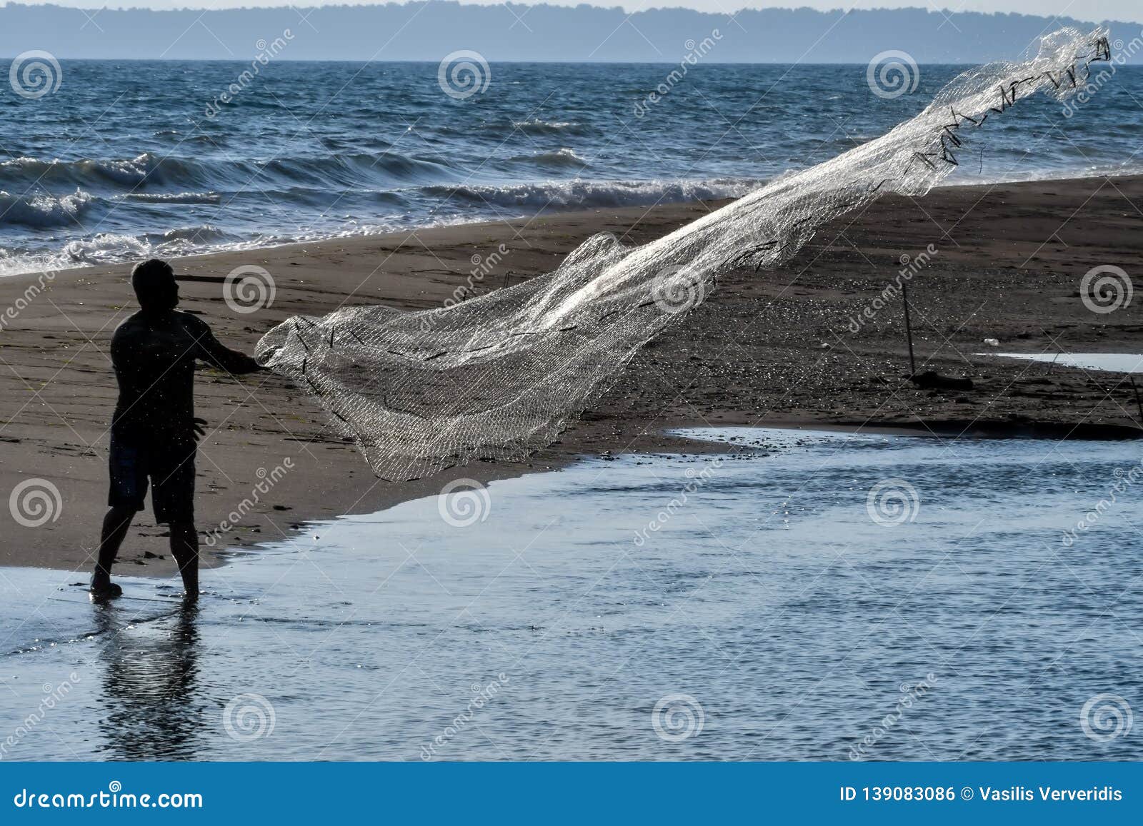 Fisherman Casting Net during Daylight in Delta of the River Alpheios in ...