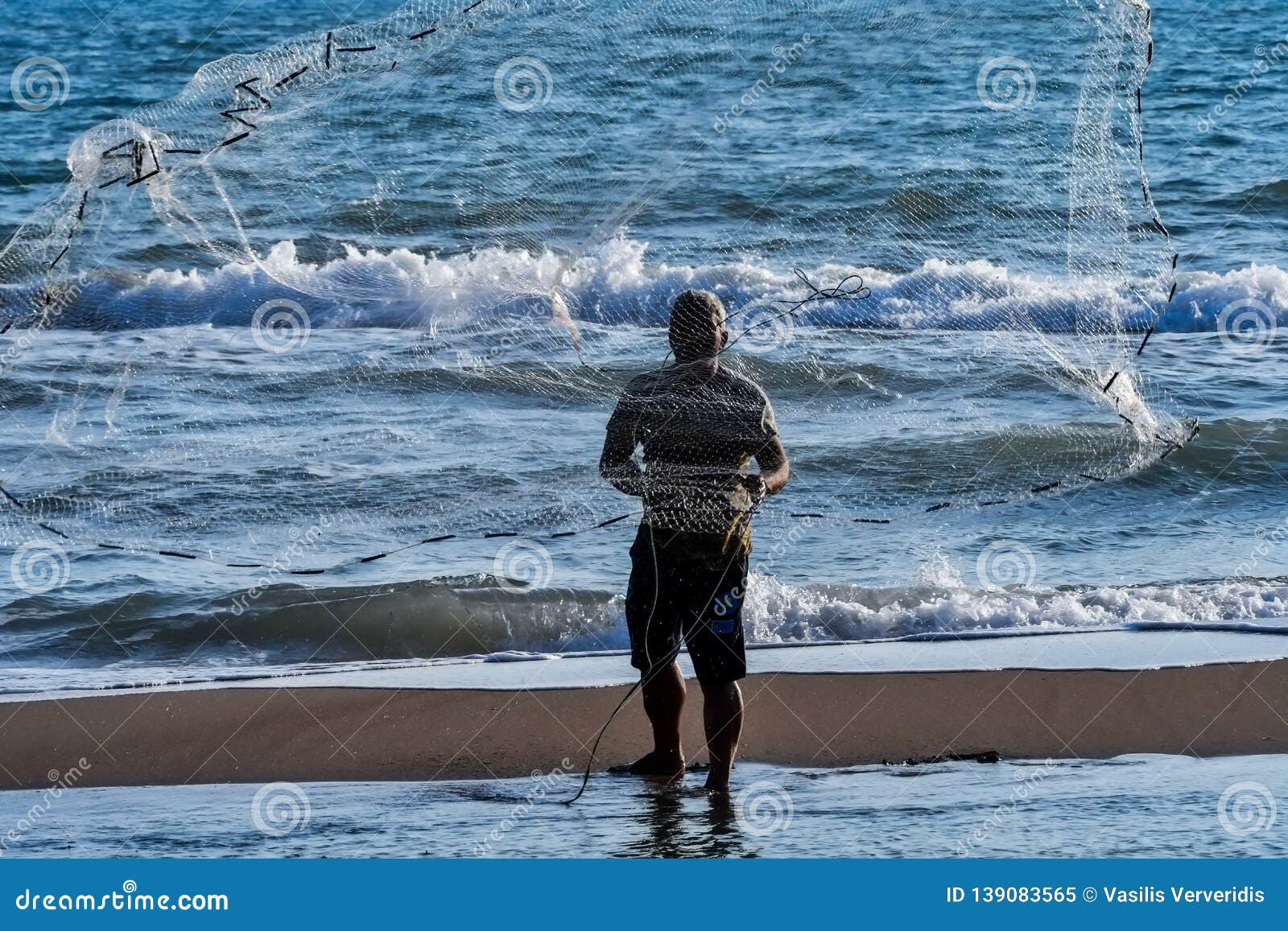 Fisherman Casting Net during Daylight in Delta of the River Alpheios in ...