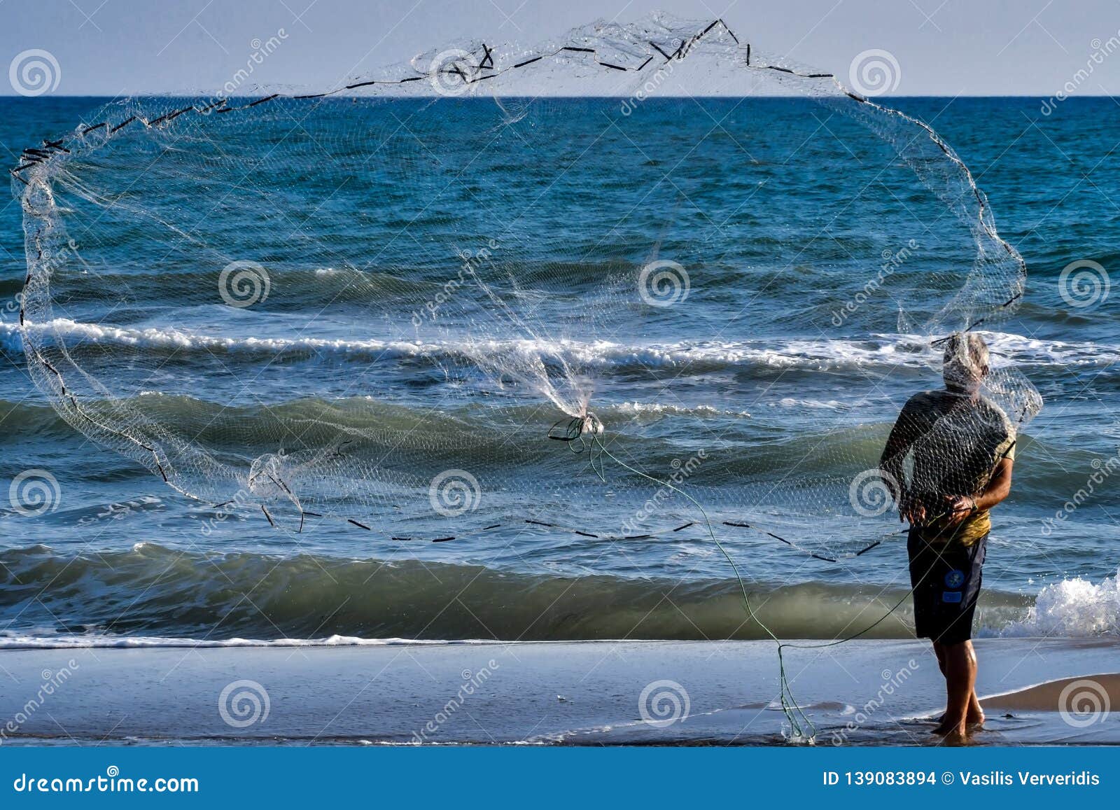 Fisherman Casting Net during Daylight in Delta of the River Alpheios in ...