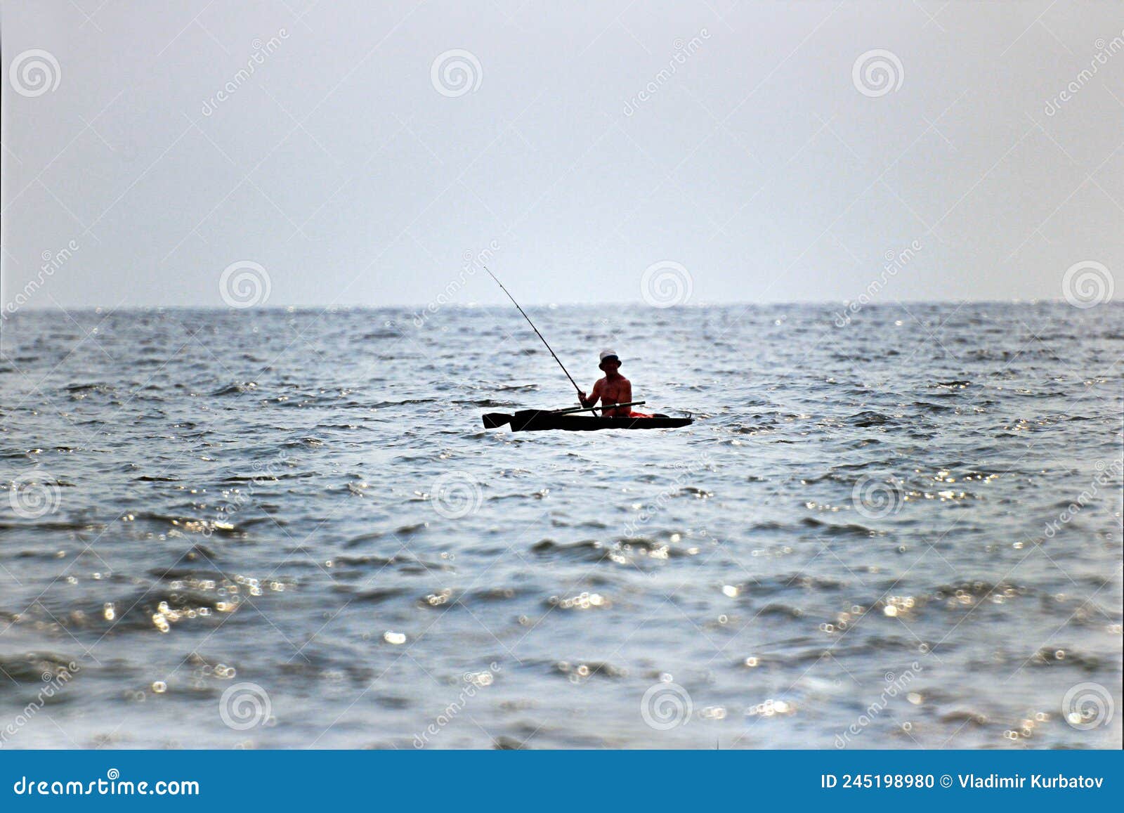Fisherman Catches Fish in the Sea on a Boat Stock Photo - Image of ...