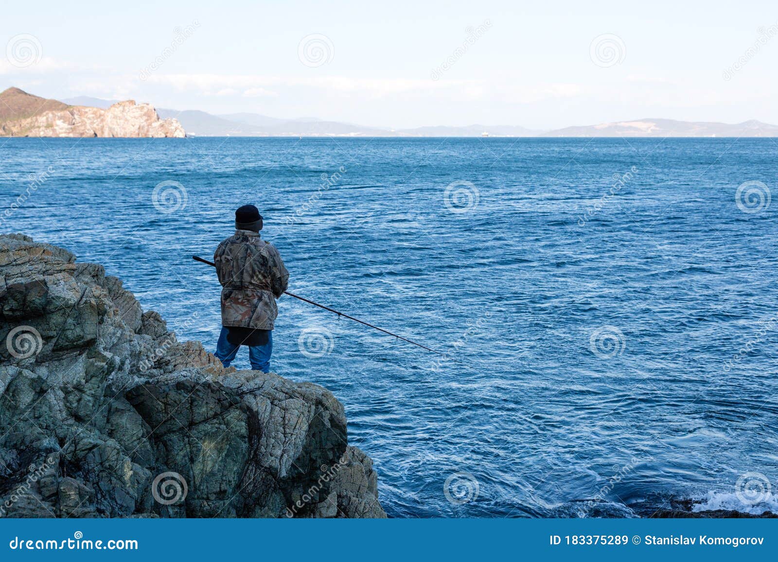 Fisherman Catches Fish from the Rocks Stock Image - Image of relaxation ...