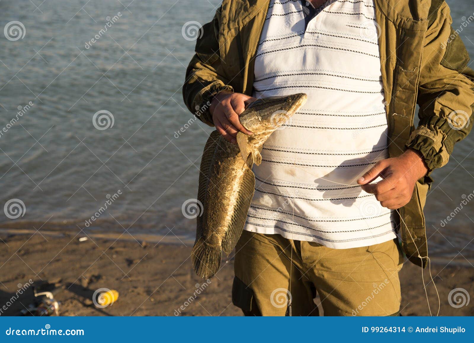 The Fisherman Caught the Fish on a Fishing Pole Stock Photo - Image of ...