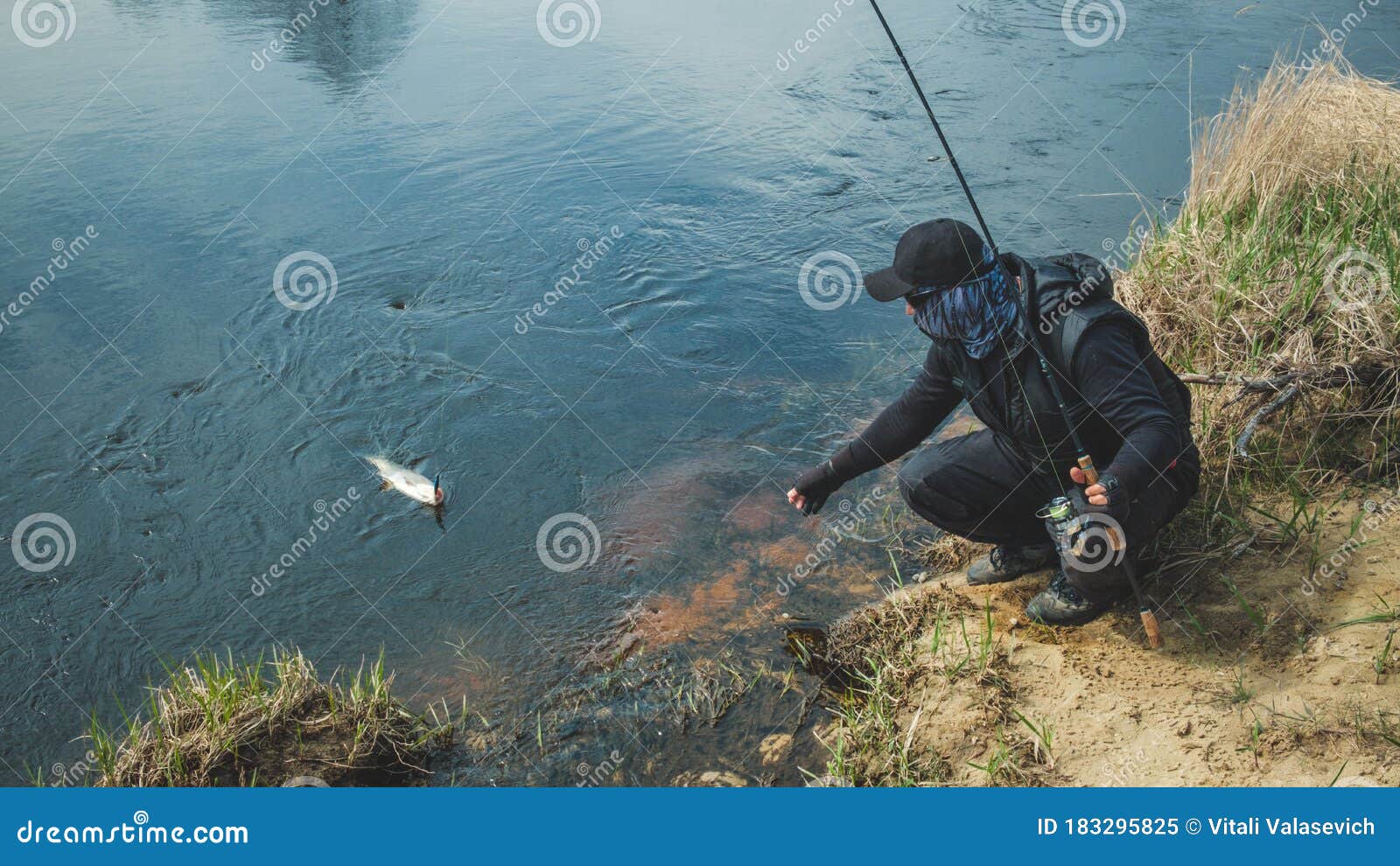 Fisherman Caught a Fish on the River Bank Stock Image - Image of ...