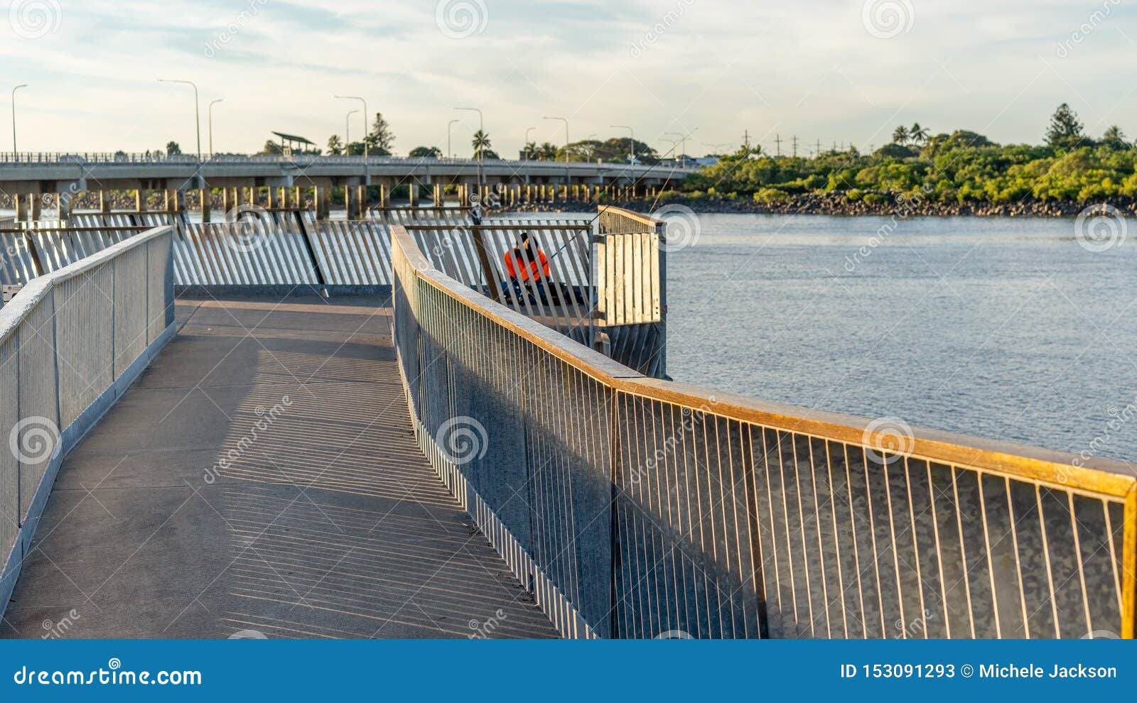 Fisherman at End of a River Jetty Stock Image - Image of catching, levy ...