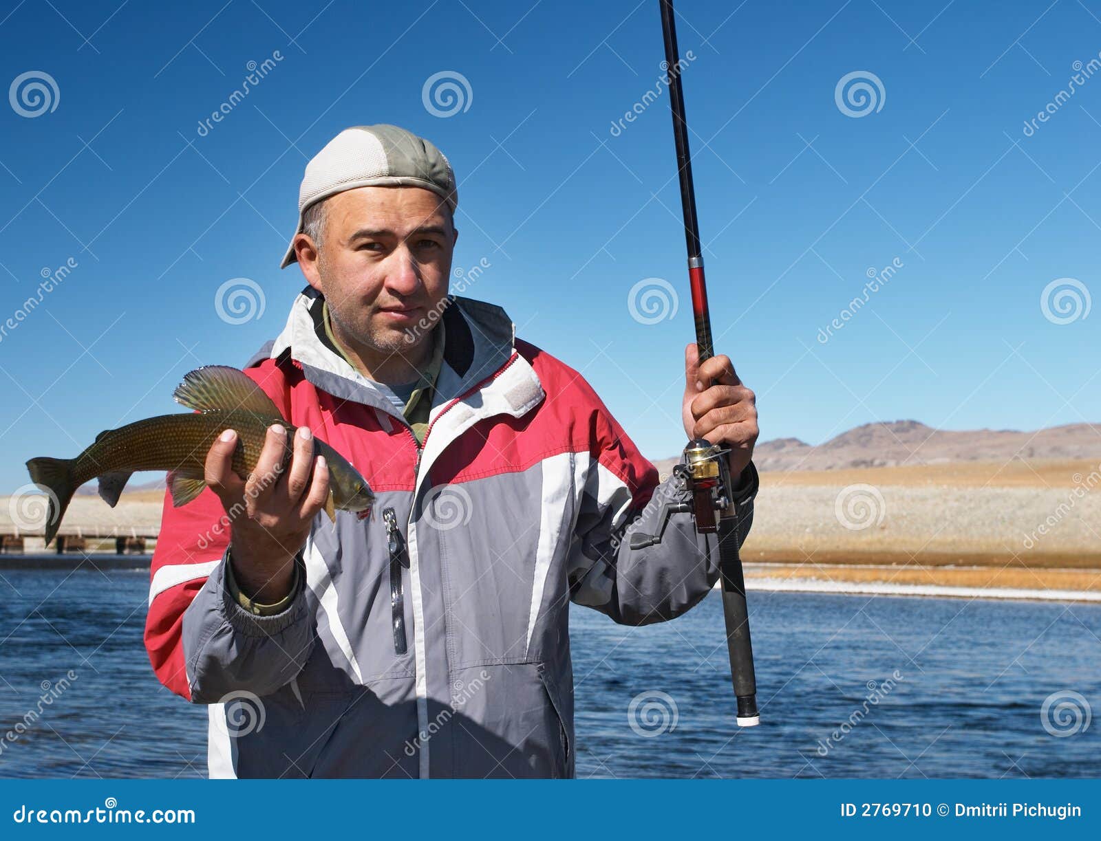 Fisherman with a fish stock photo. Image of serene, fish - 2769710