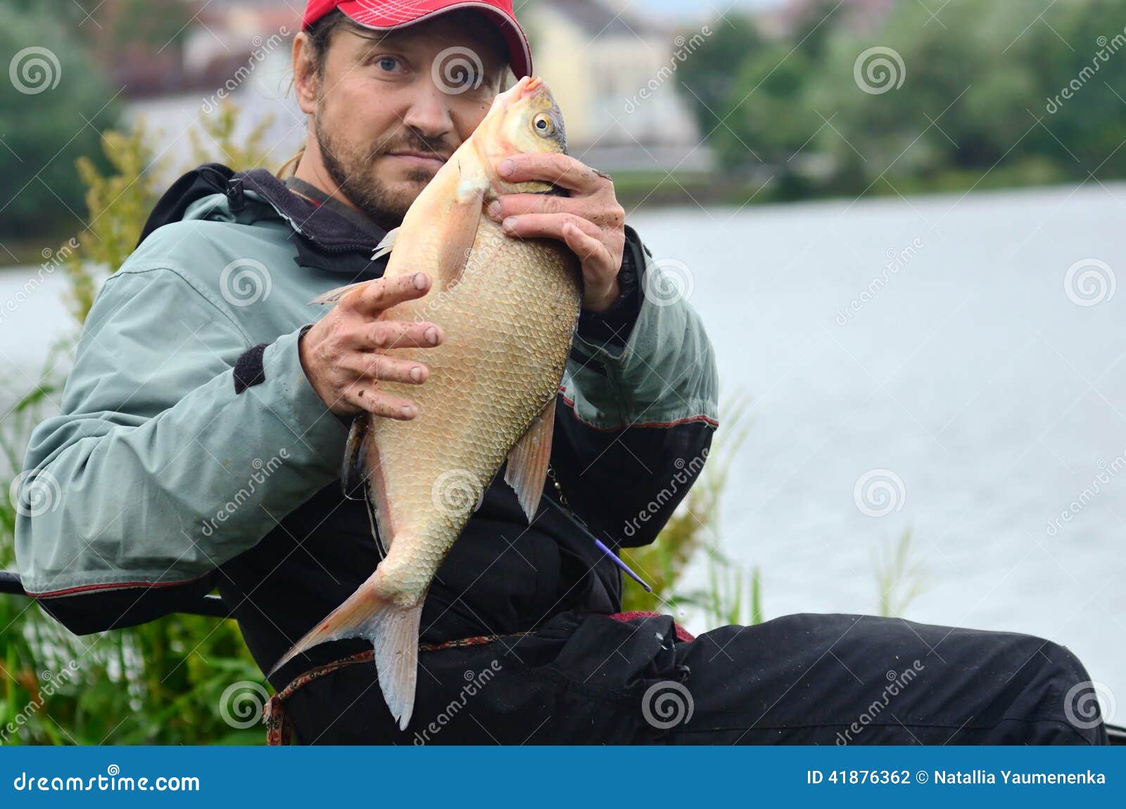 Fisherman with fish stock photo. Image of pursuit, activity - 41876362
