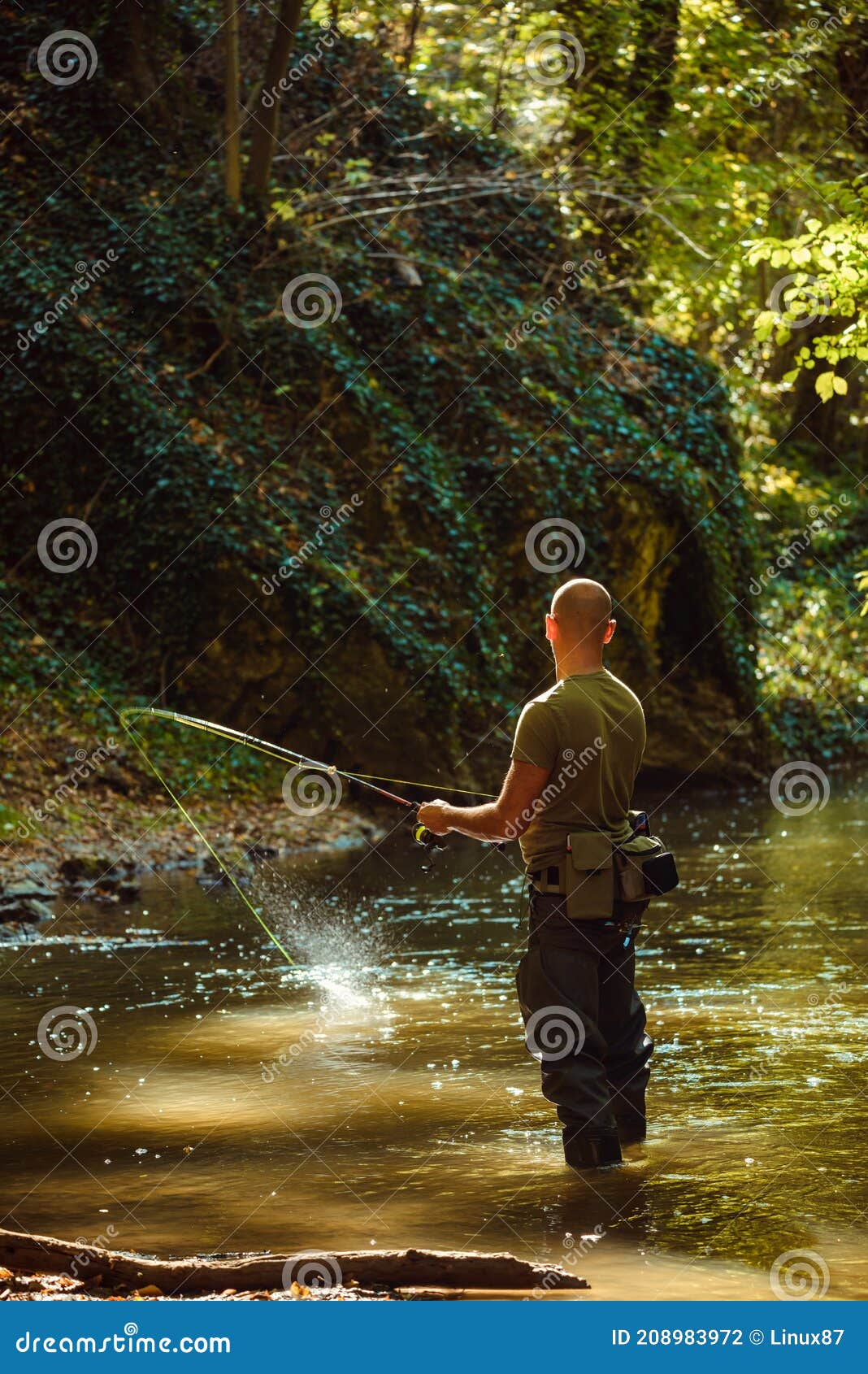 A Fisherman Fishing with Fly Fishing Stock Photo - Image of creek ...