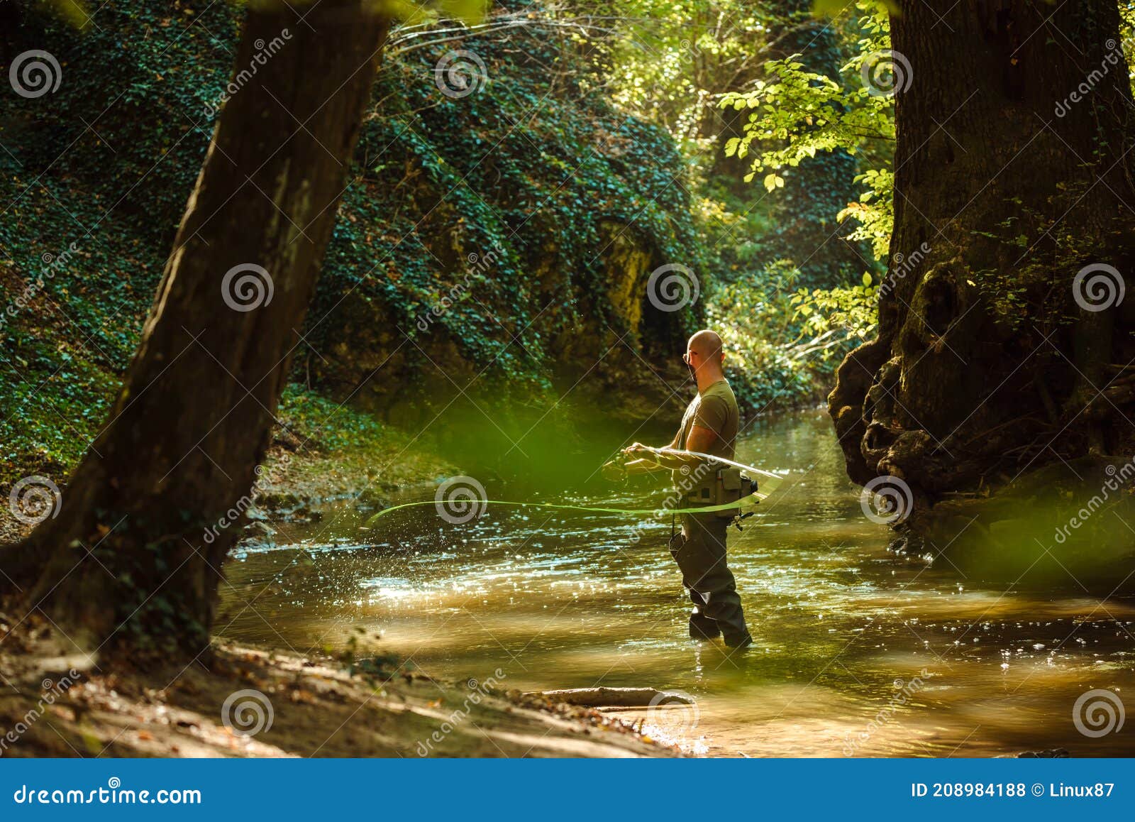 A Fisherman Fishing in the Flowing Stream Stock Photo - Image of hobby ...