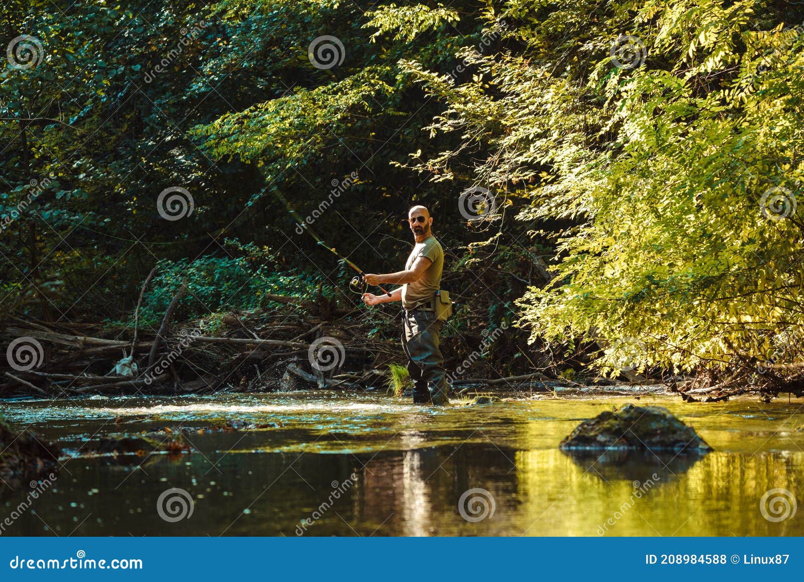 A Fisherman Fishing in the Flowing Stream Stock Photo - Image of people ...