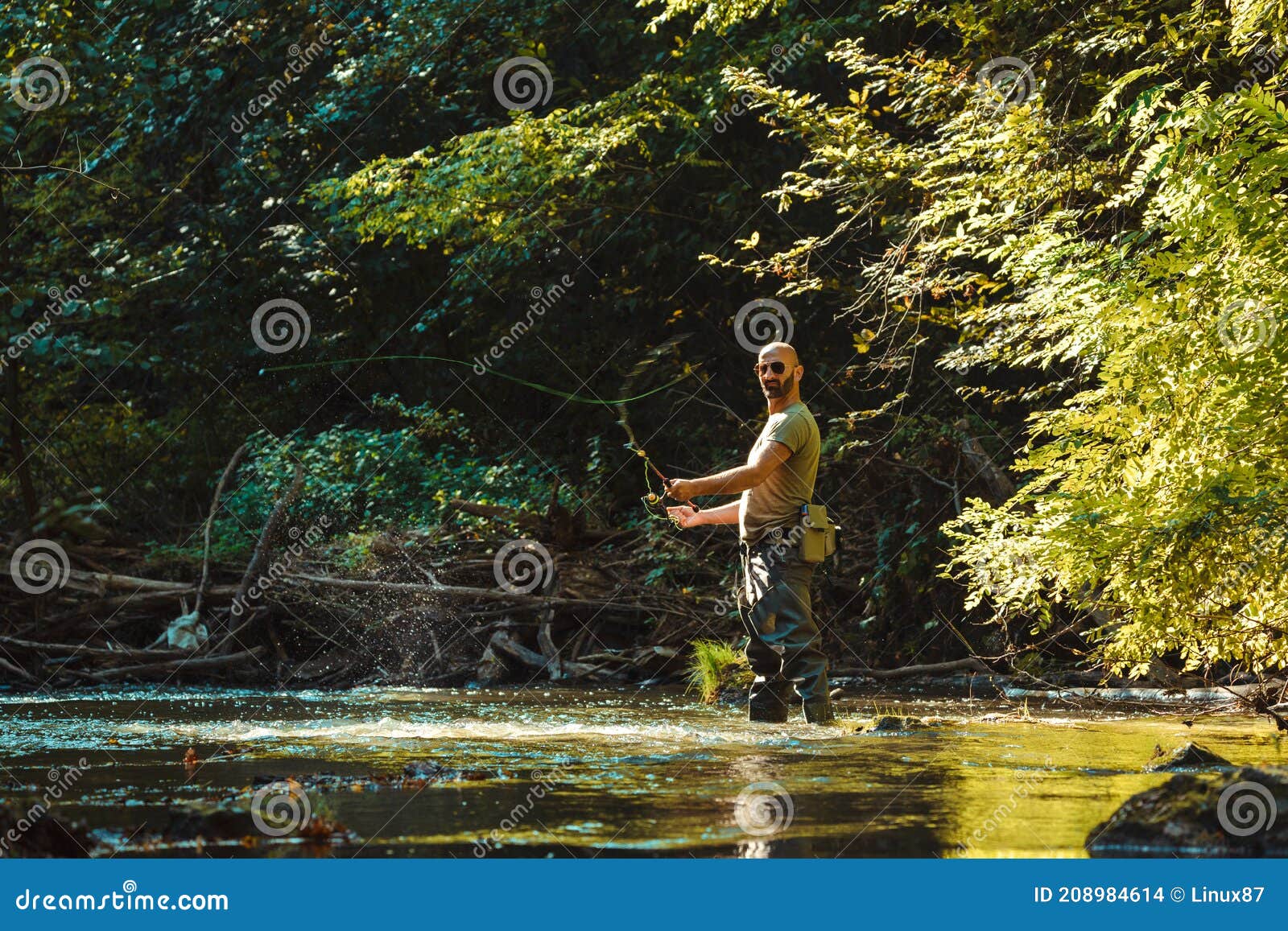 A Fisherman Fishing in the Flowing Stream Stock Photo - Image of river ...