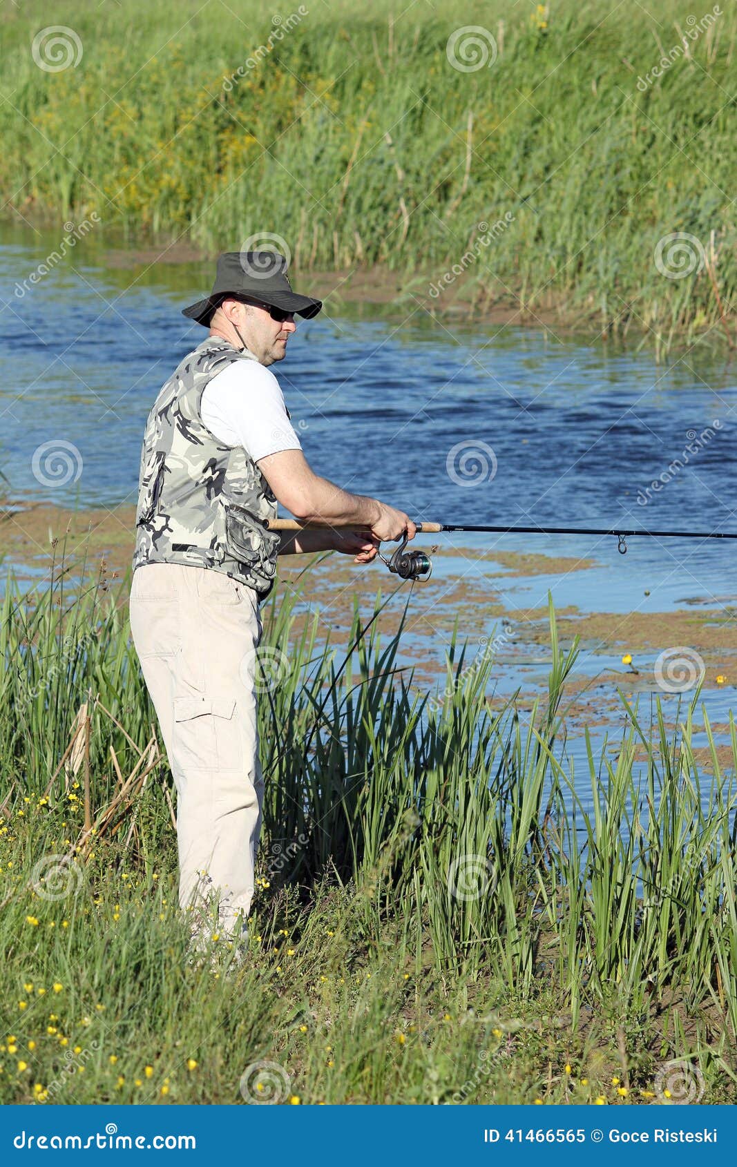 Fisherman with fishing rod stock image. Image of water - 41466565