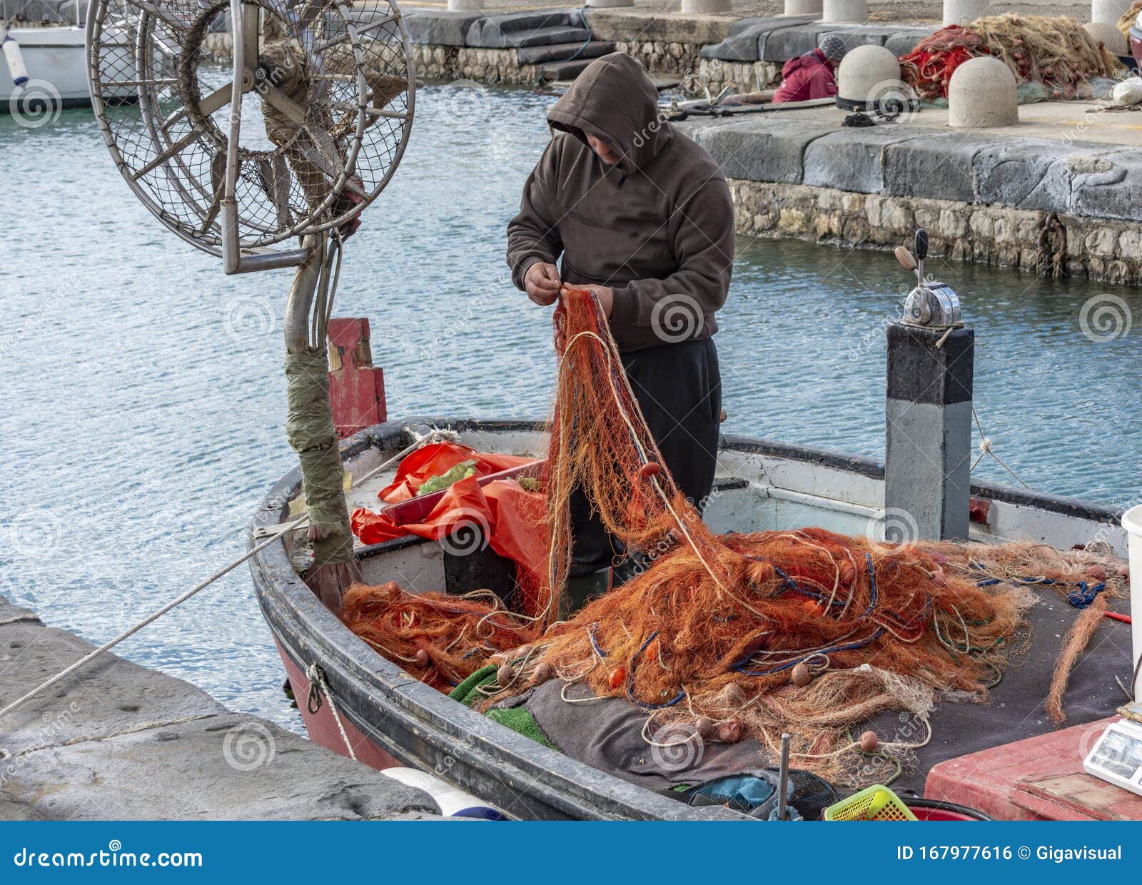 Fisherman Fixing the Net on the Boat Editorial Photo - Image of workman ...