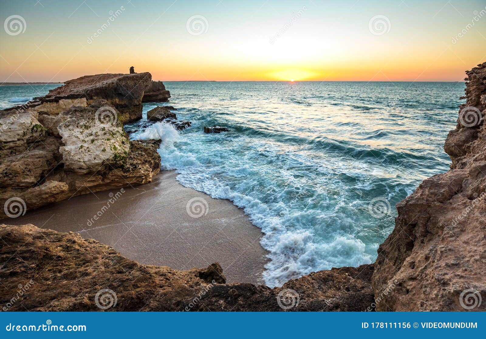 Fisherman on a High Cliff Over Dramatic Ocean at Sunset Stock Photo ...