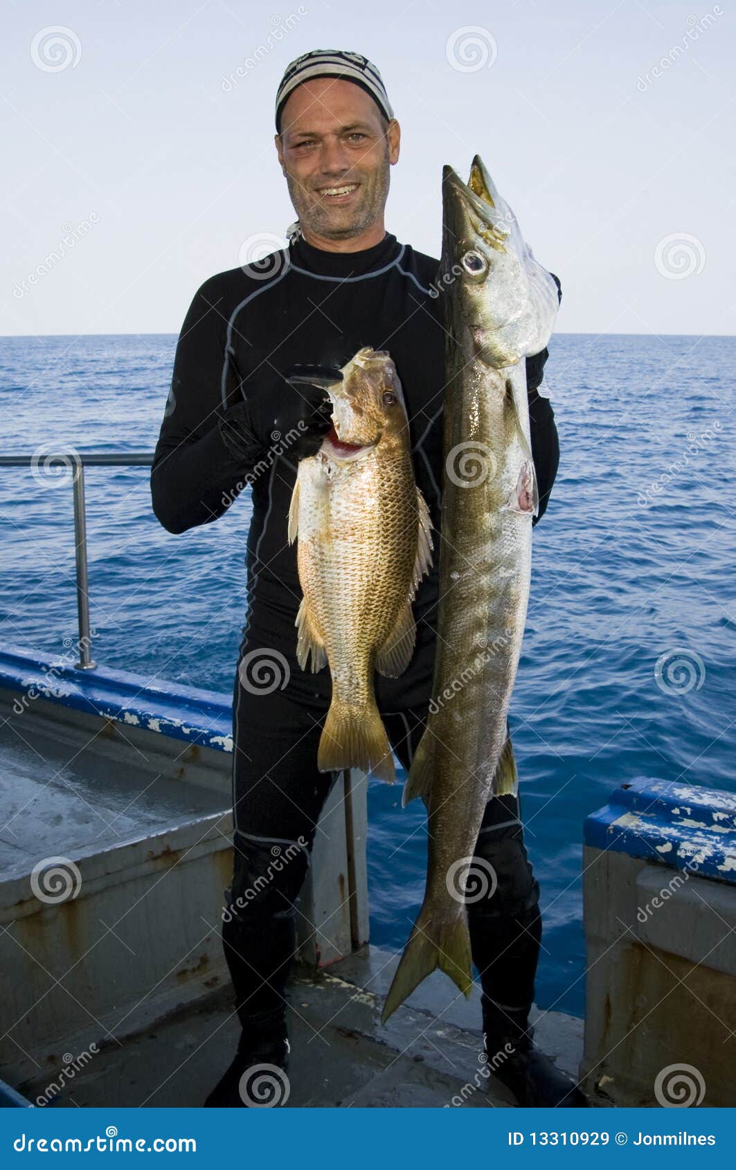 Fisherman Hold Two Big Fish Up Stock Image - Image of activity, chang ...