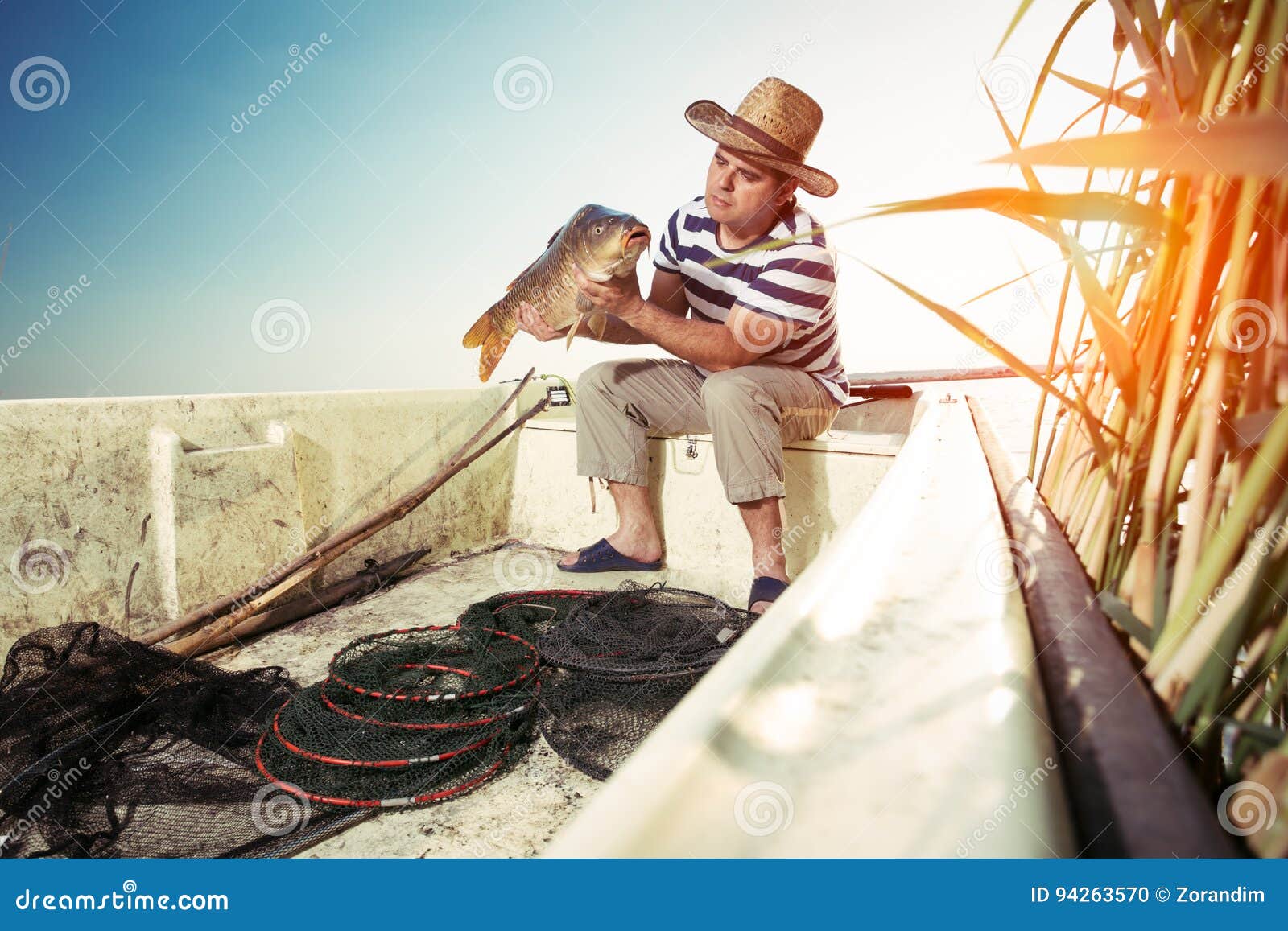 Fisherman Holding a Big Fish Stock Photo - Image of travel, mirror ...