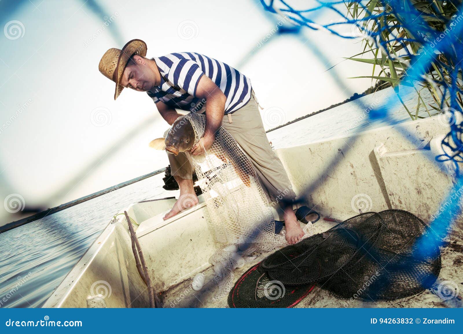 Fisherman Holding a Big Fish Stock Photo - Image of background, mirror ...