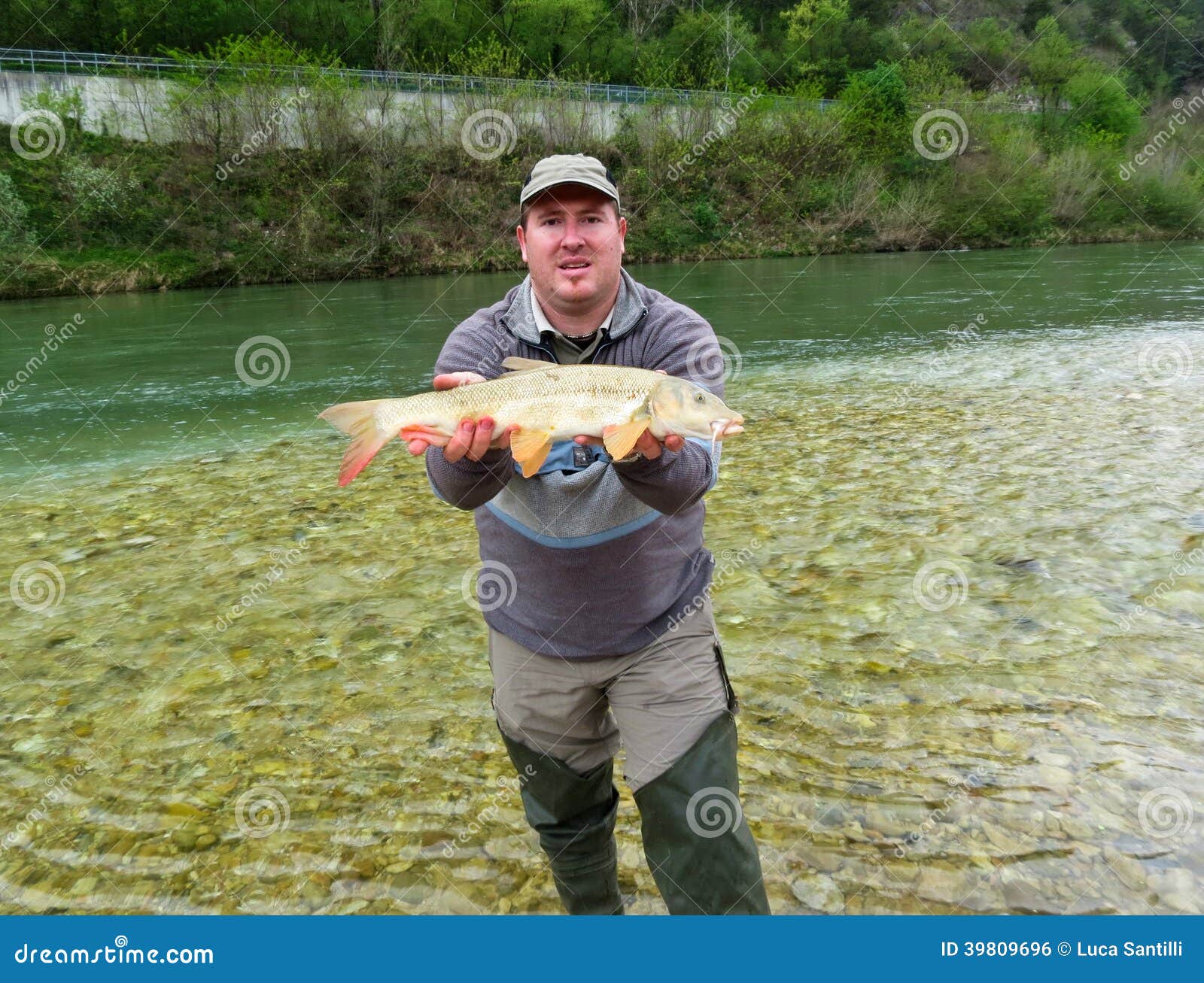 Fisherman Holding a Fresh Caught Fish Stock Photo - Image of barbel ...