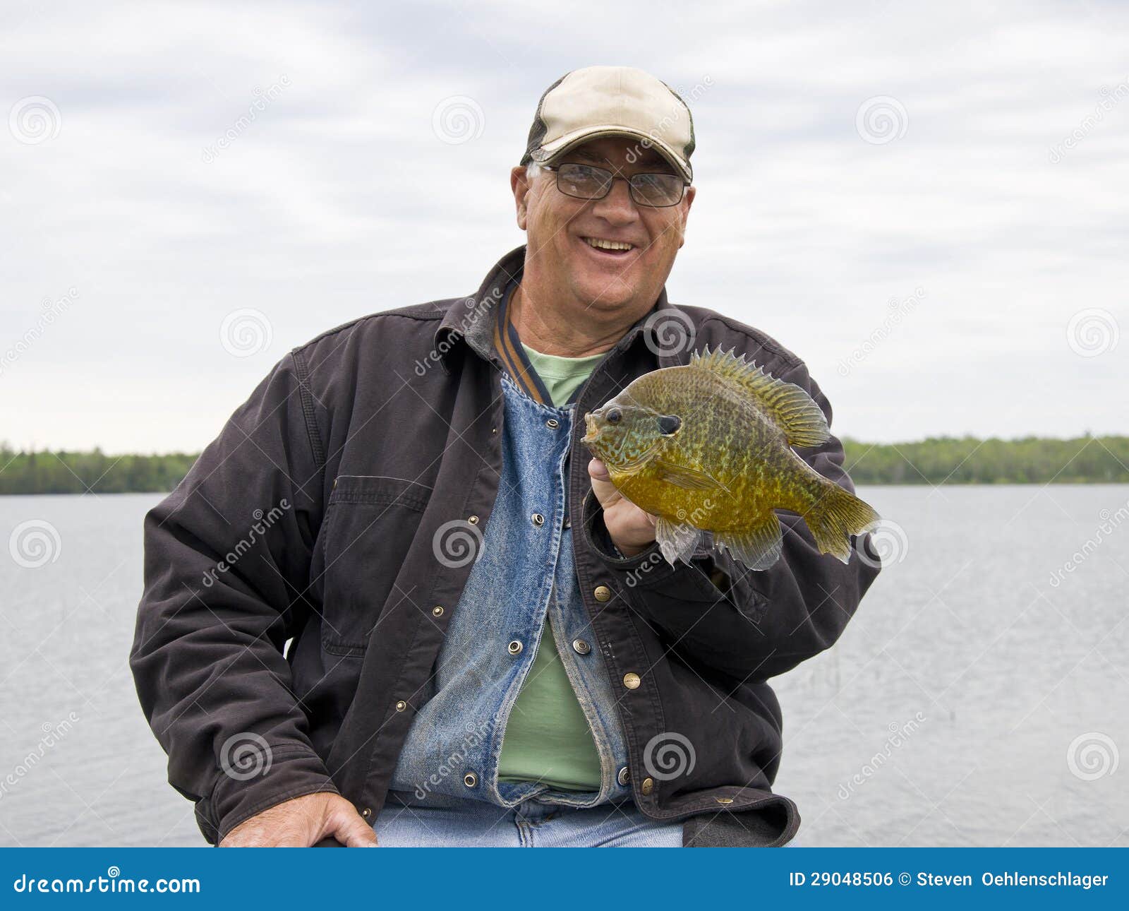 Fisherman with a Large Sunfish Stock Photo - Image of lake, spring ...