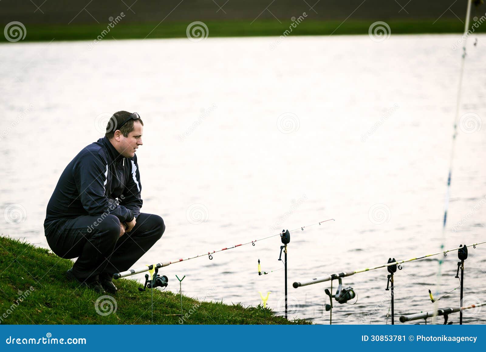 Fisherman Looking at His Rods Waiting for a Fish Stock Image - Image of ...