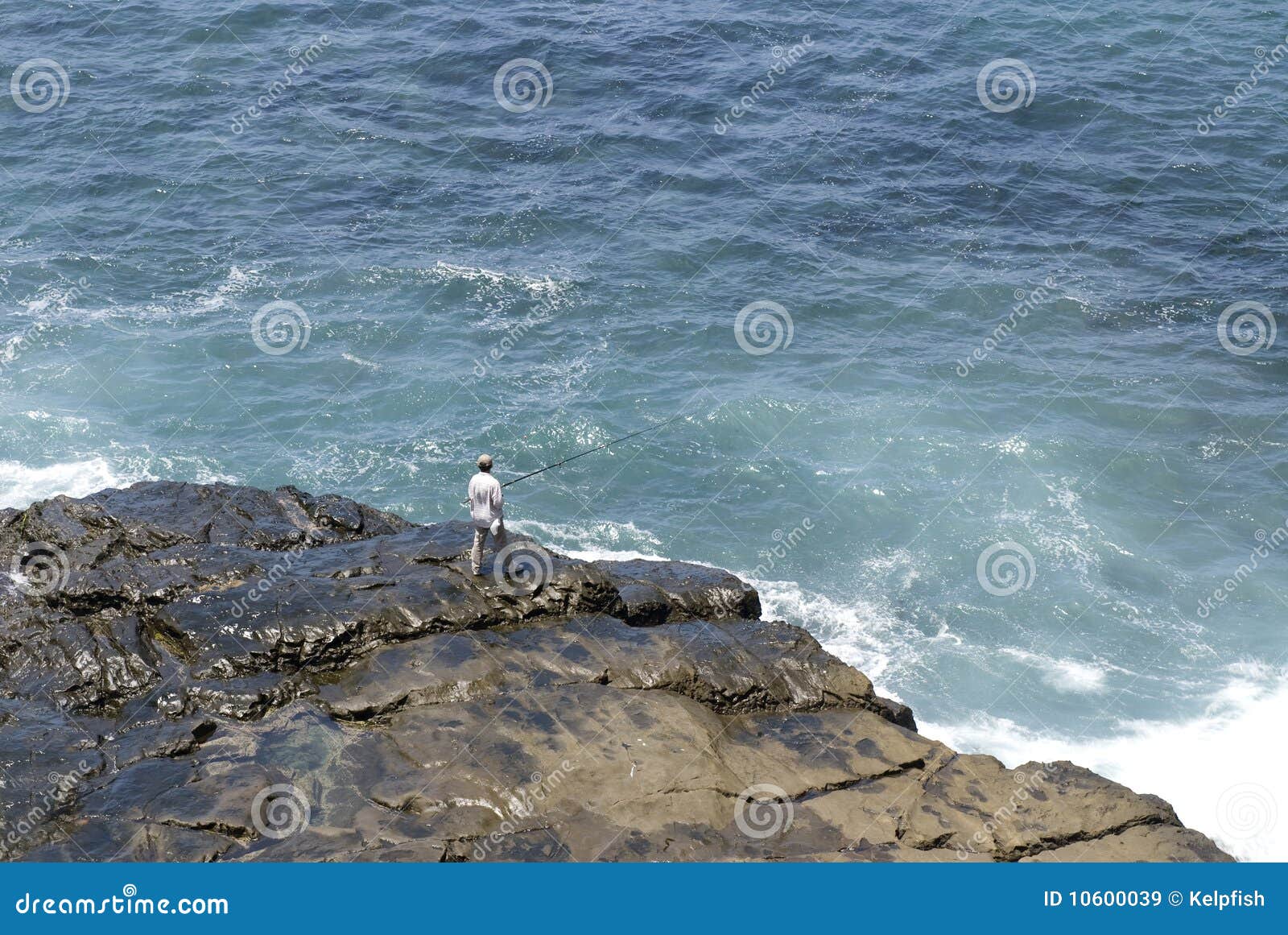 Fisherman on remore reef stock image. Image of nature - 10600039