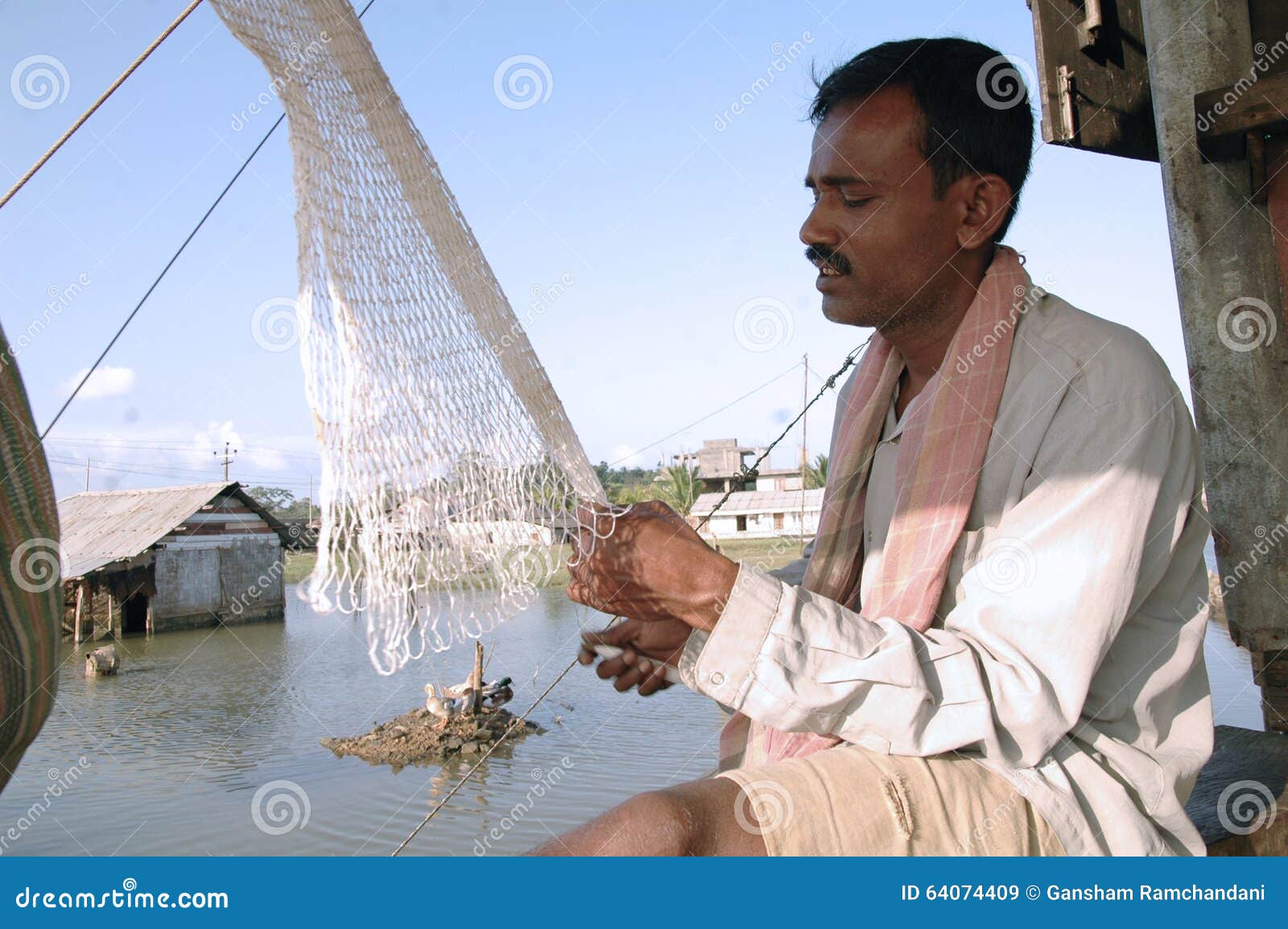 Fisherman repairing net editorial stock image. Image of nature - 64074409