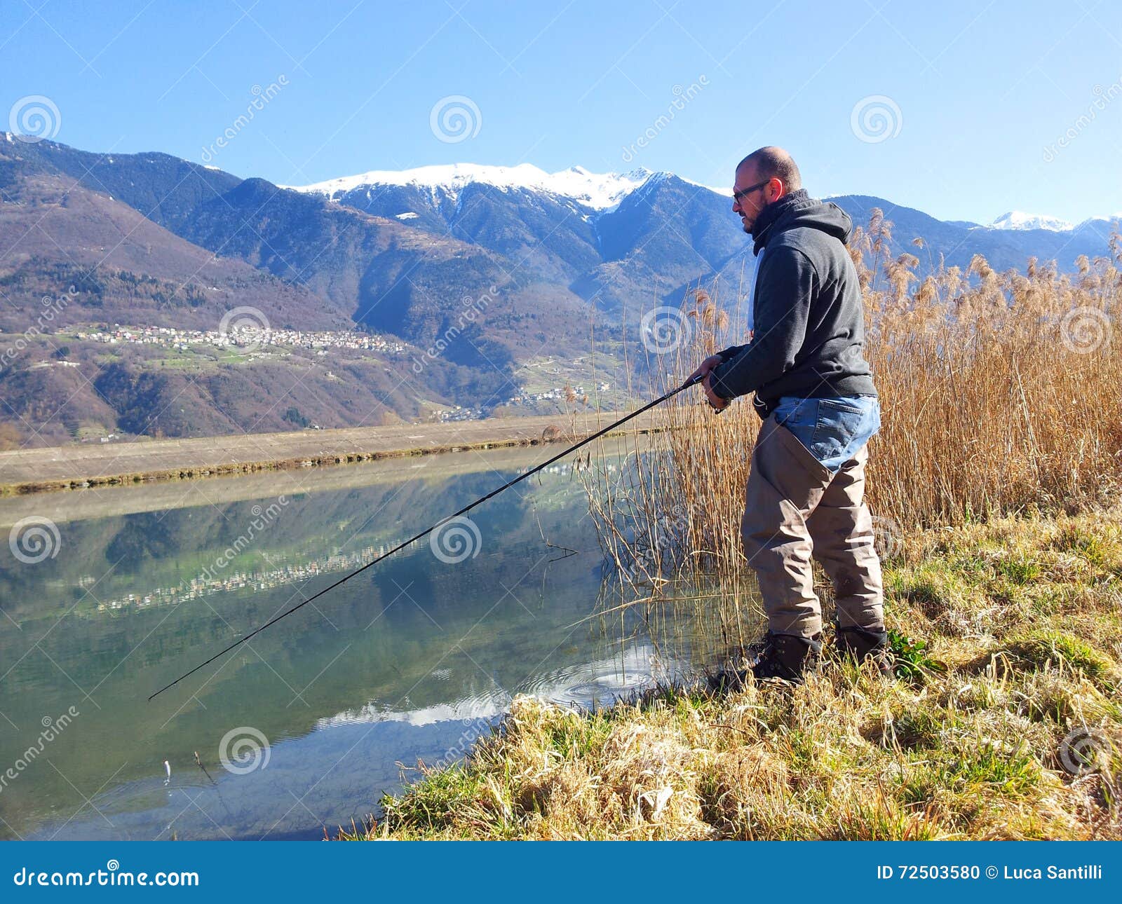 Fisherman on the River Bank Stock Photo - Image of hobby, happy: 72503580
